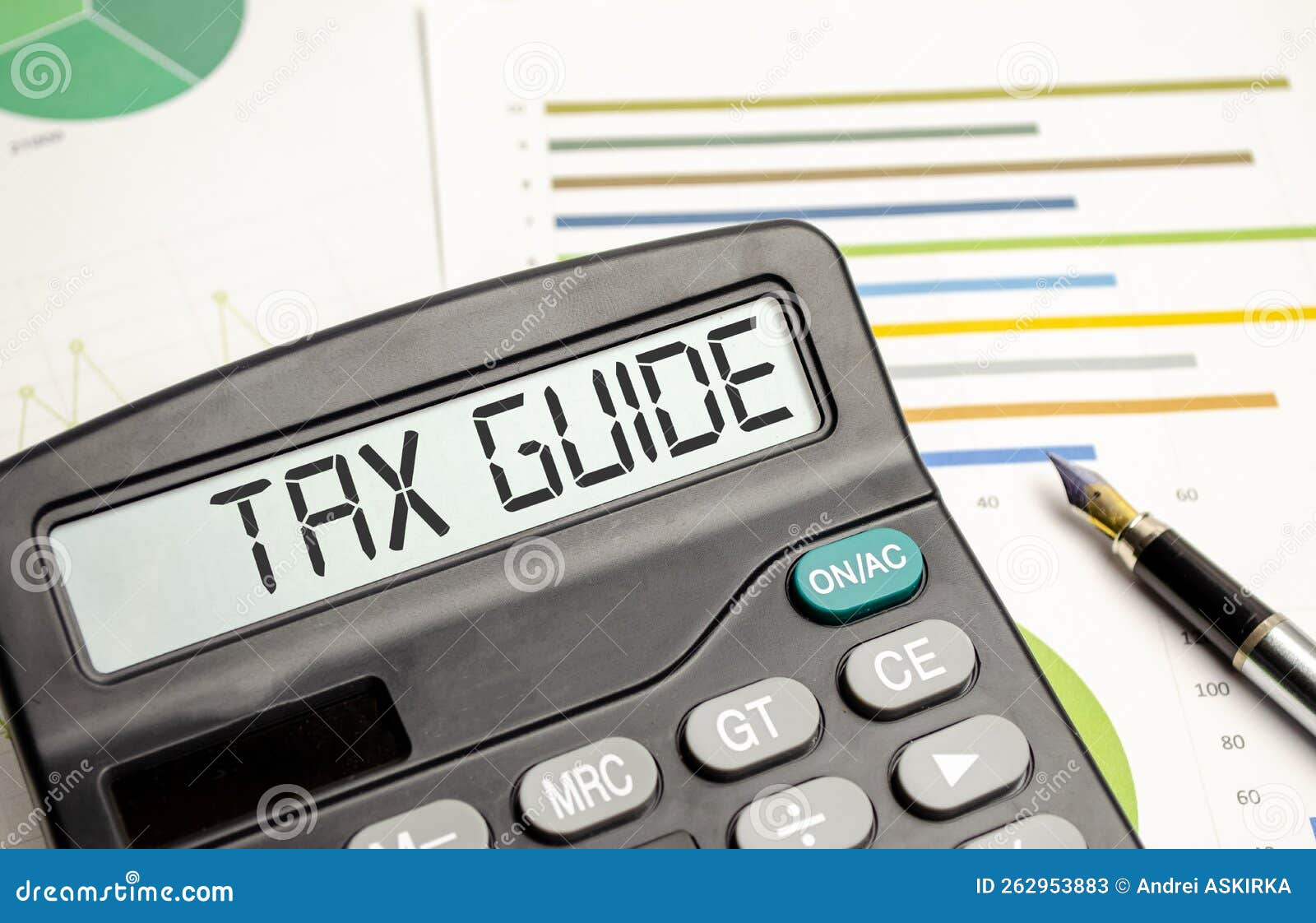 Tax Guide on Calculator Display and Charts with Pen Stock Image - Image ...