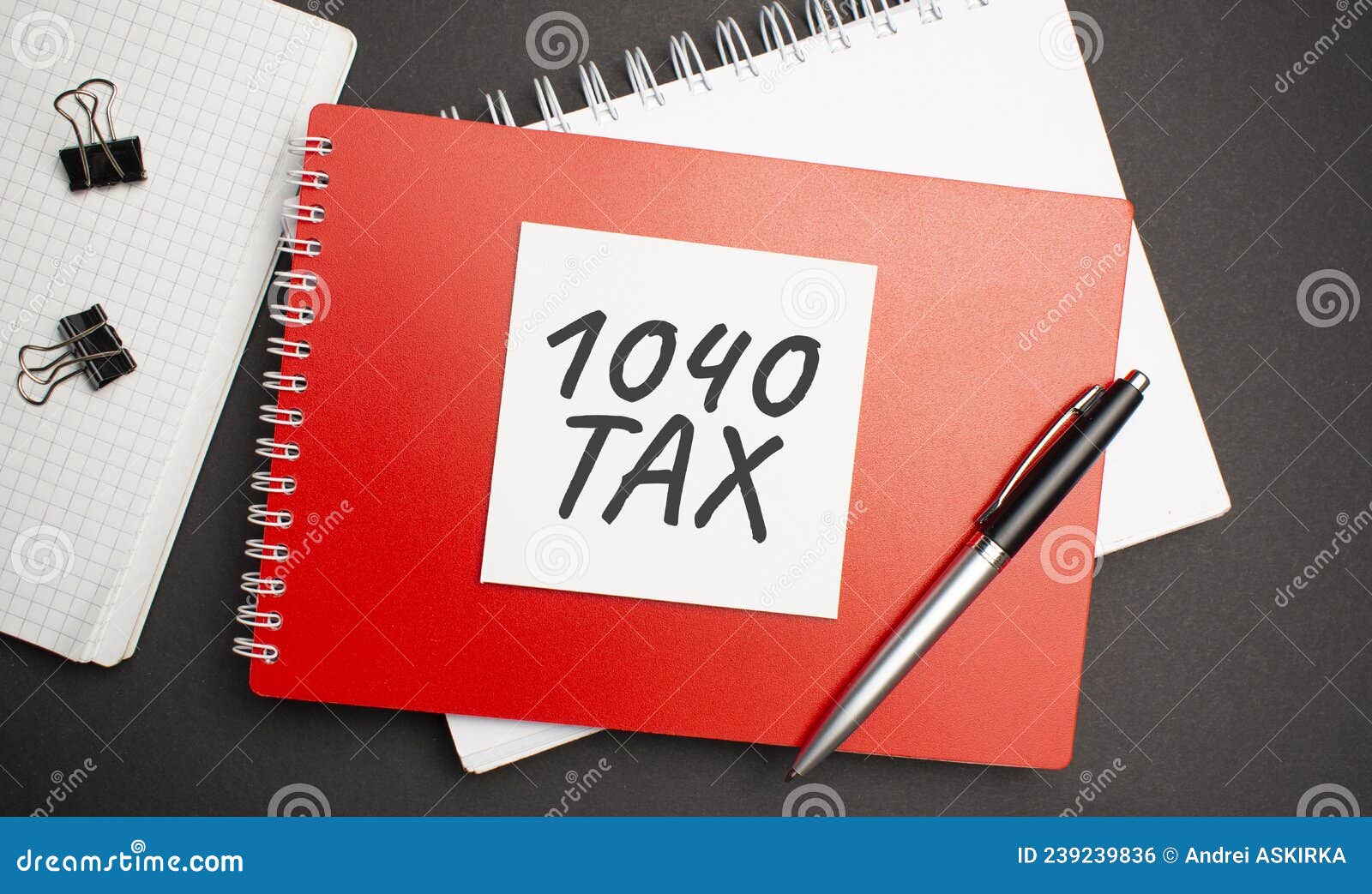 1040 Tax Sign on Sheet of Paper on the Red Notepad with Pen Stock Photo ...
