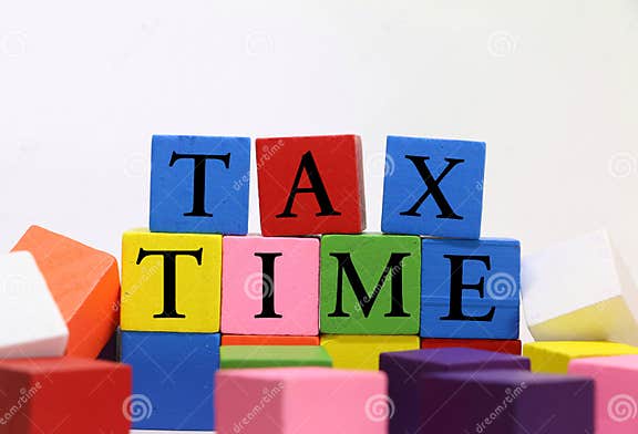Tax Time Word Written on Multi Coloured Wooden Blocks Isolated on White ... Tax Time Word Written on Multi Coloured Wooden Blocks Isolated on White ...