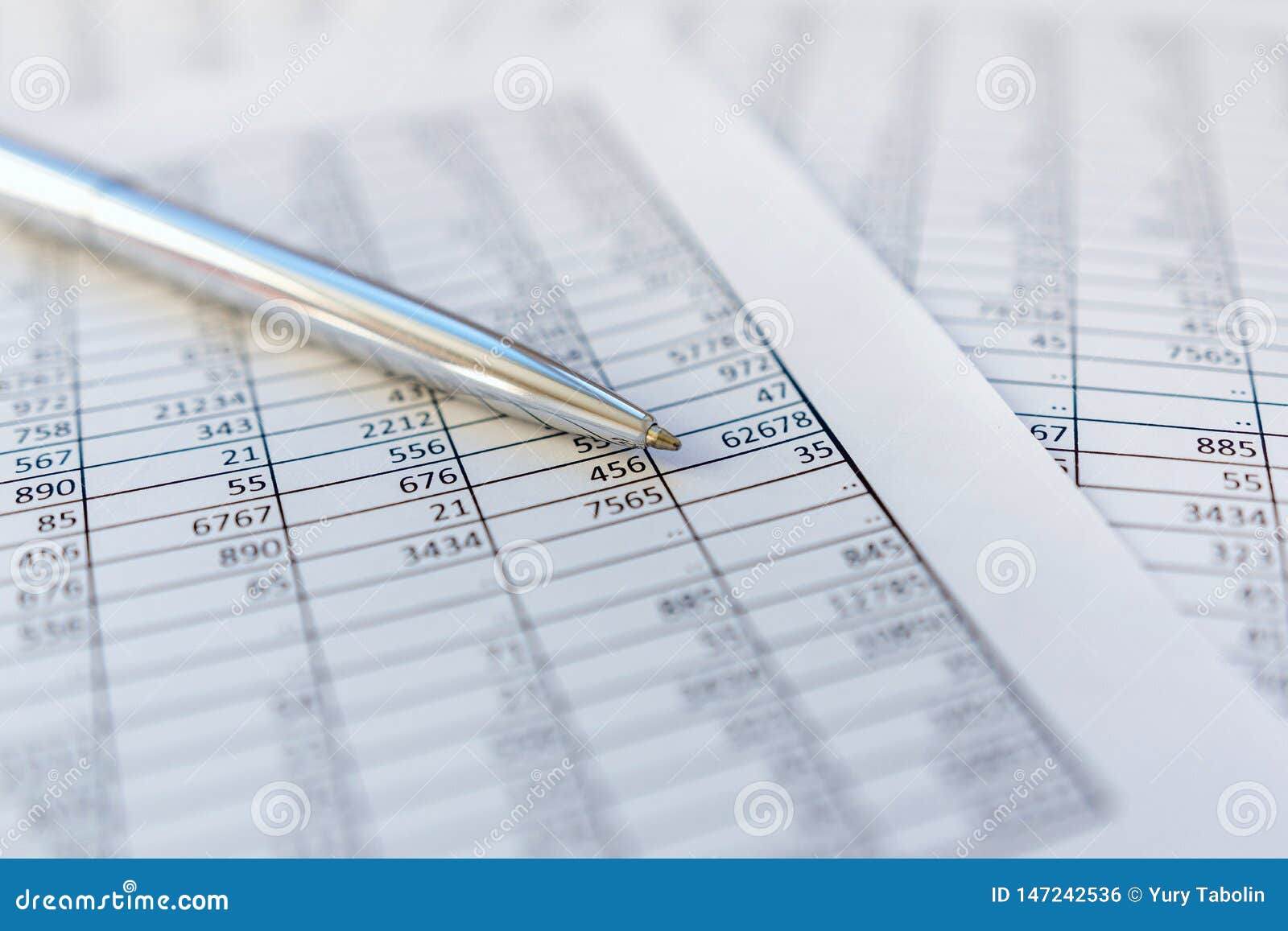 Taxes and Accounting. Summary Table. Pen and Notebook on Papers with ...