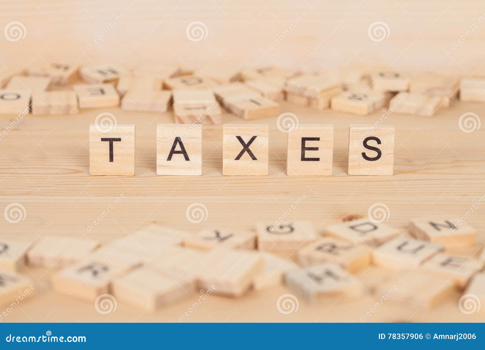 Taxes word written on wood stock photo. Image of text - 78357906