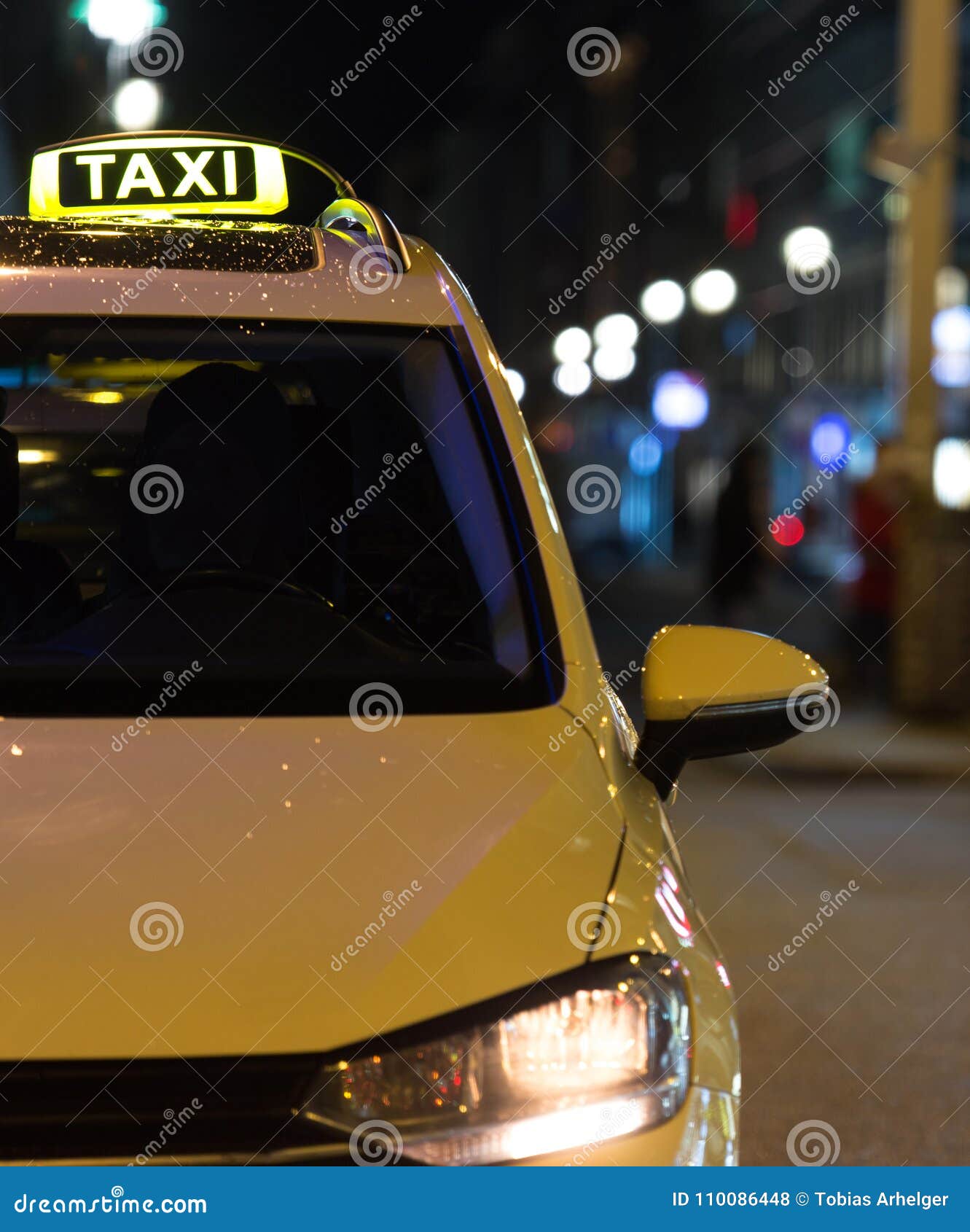 Taxi in a city at night stock photo. Image of transportation - 110086448