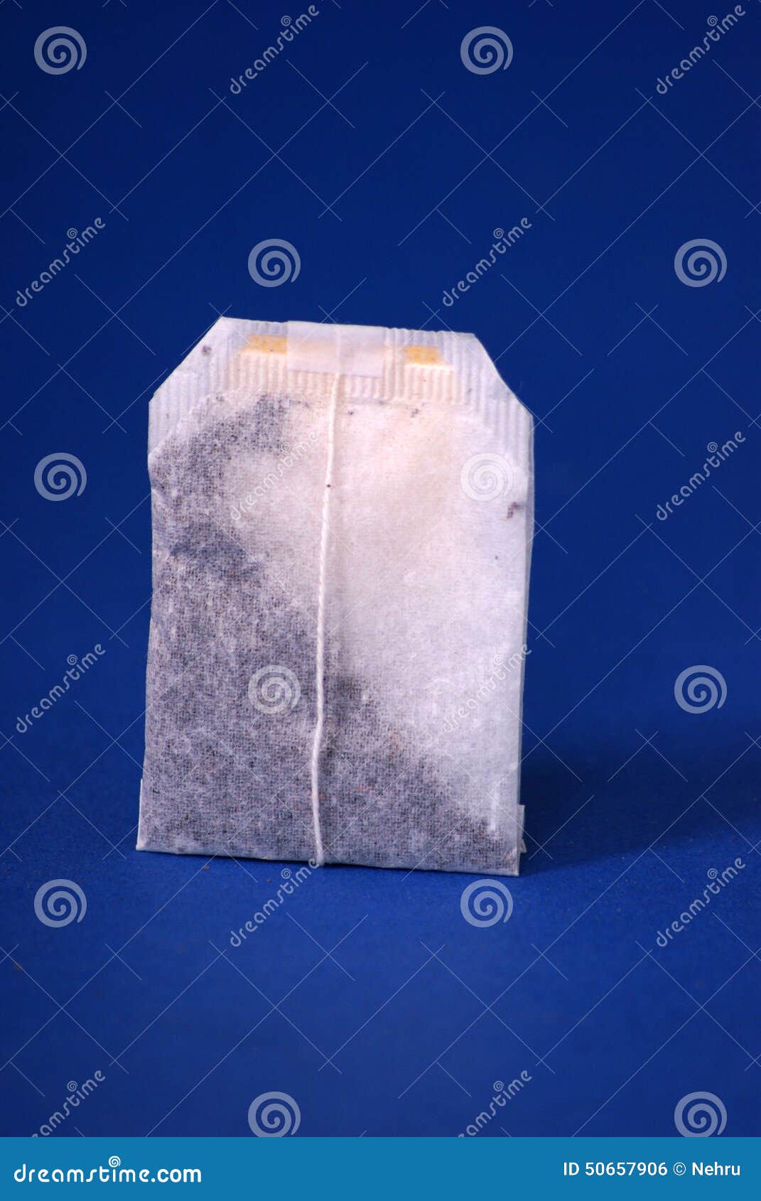 Tea Bag on a Blue Background Stock Photo - Image of food, black: 50657906