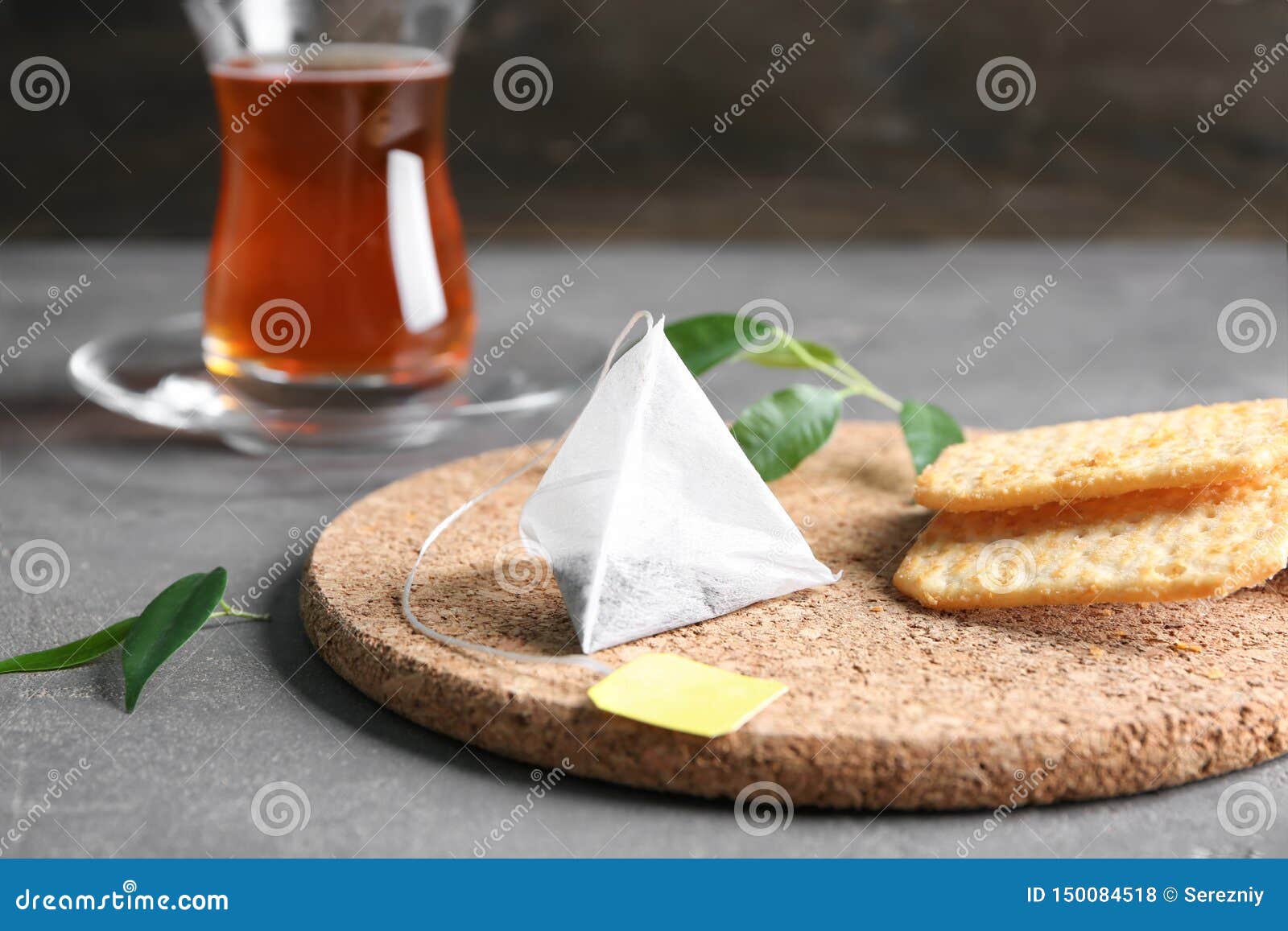 Tea Bag and Crackers on Table Stock Photo - Image of herbal, board ...