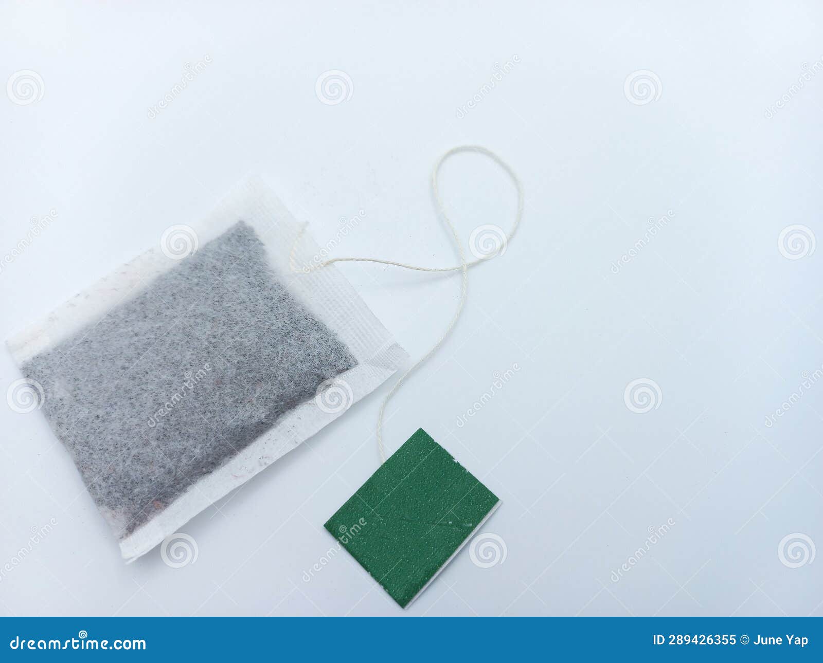 Tea Bag with Green Tag Isolated on White Background. Corner Position ...