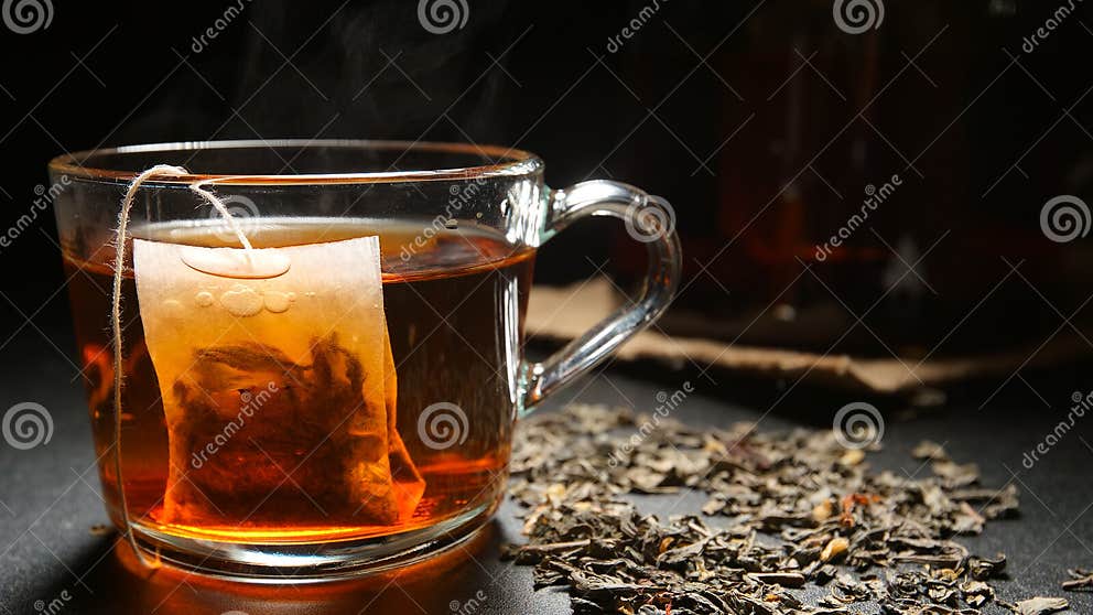 Tea Bag in a Hot Tea Cup on a Table Stock Photo - Image of herbal ...