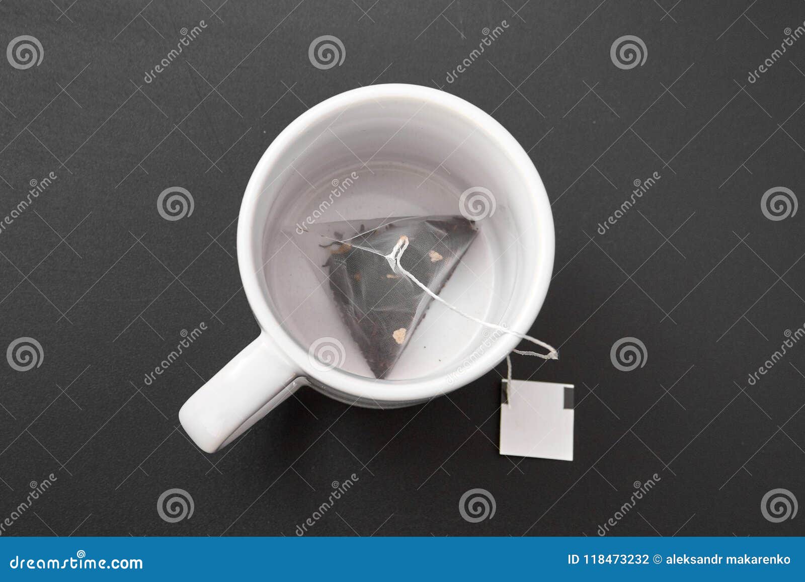 A tea bag in a white cup. stock photo. Image of coffeecup - 118473232