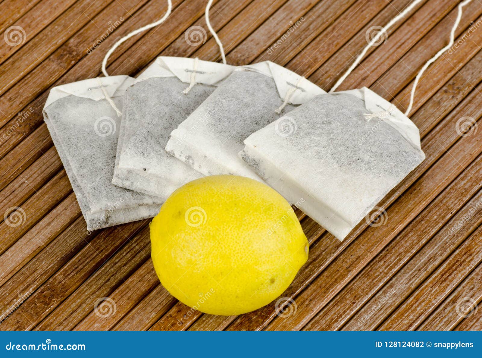 Tea bags and lemon stock photo. Image of lemon, bags - 128124082