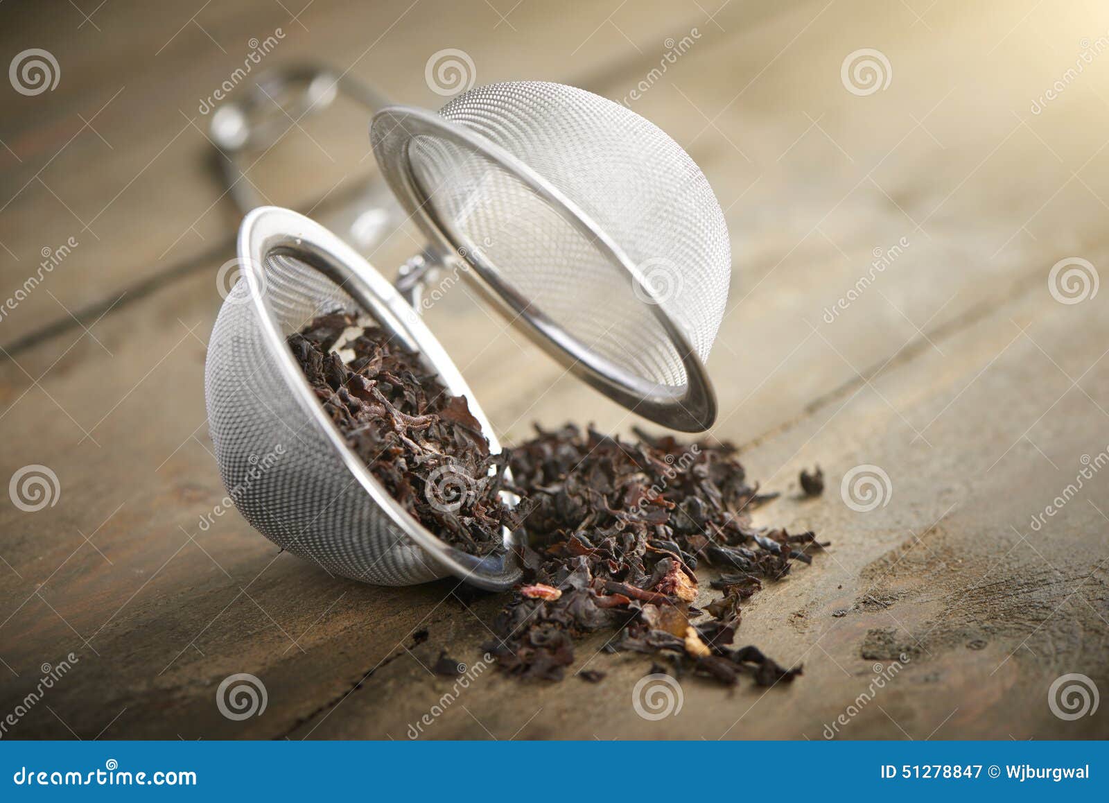 Tea Ball with Black Tea and Red Fruit Stock Image - Image of ball ...