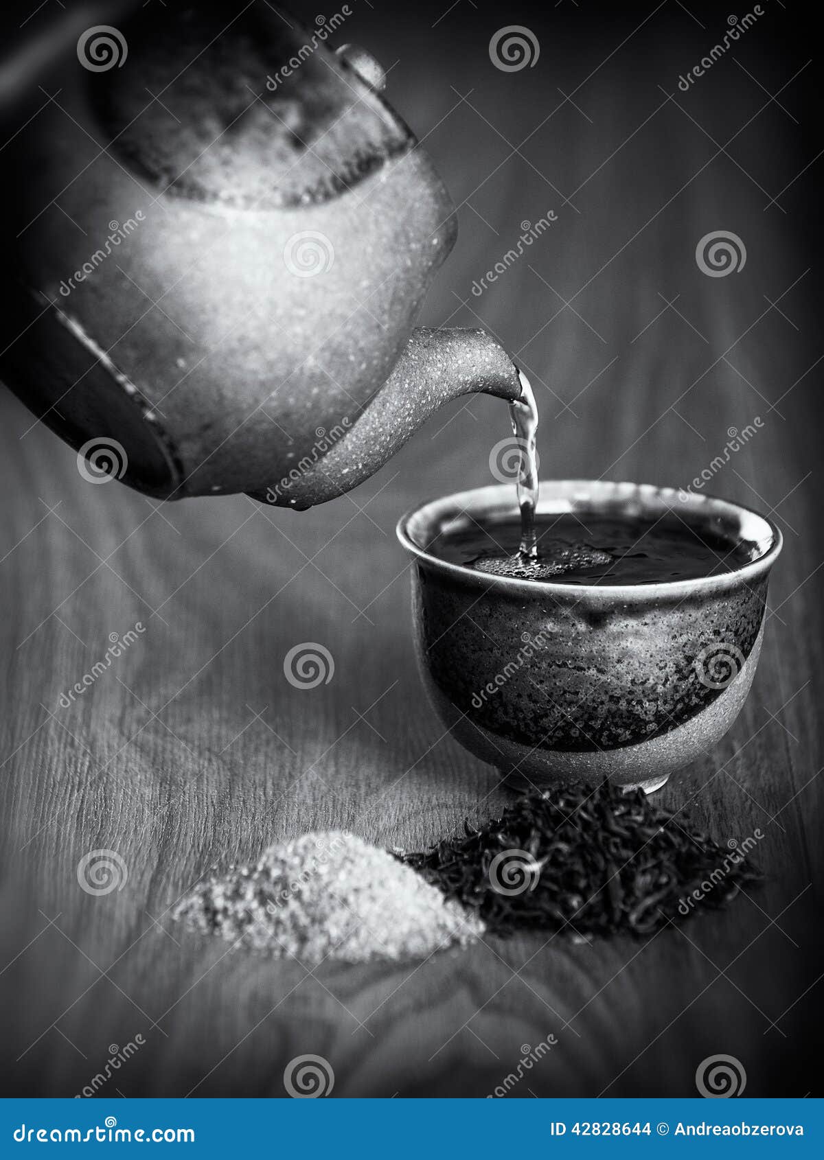 Tea Being Poured into a Ceramic Cup from a Teapot. Stock Photo - Image ...