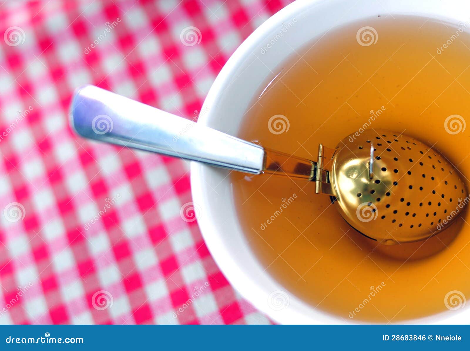 Tea brewing spoon in a cup stock photo. Image of brew - 28683846