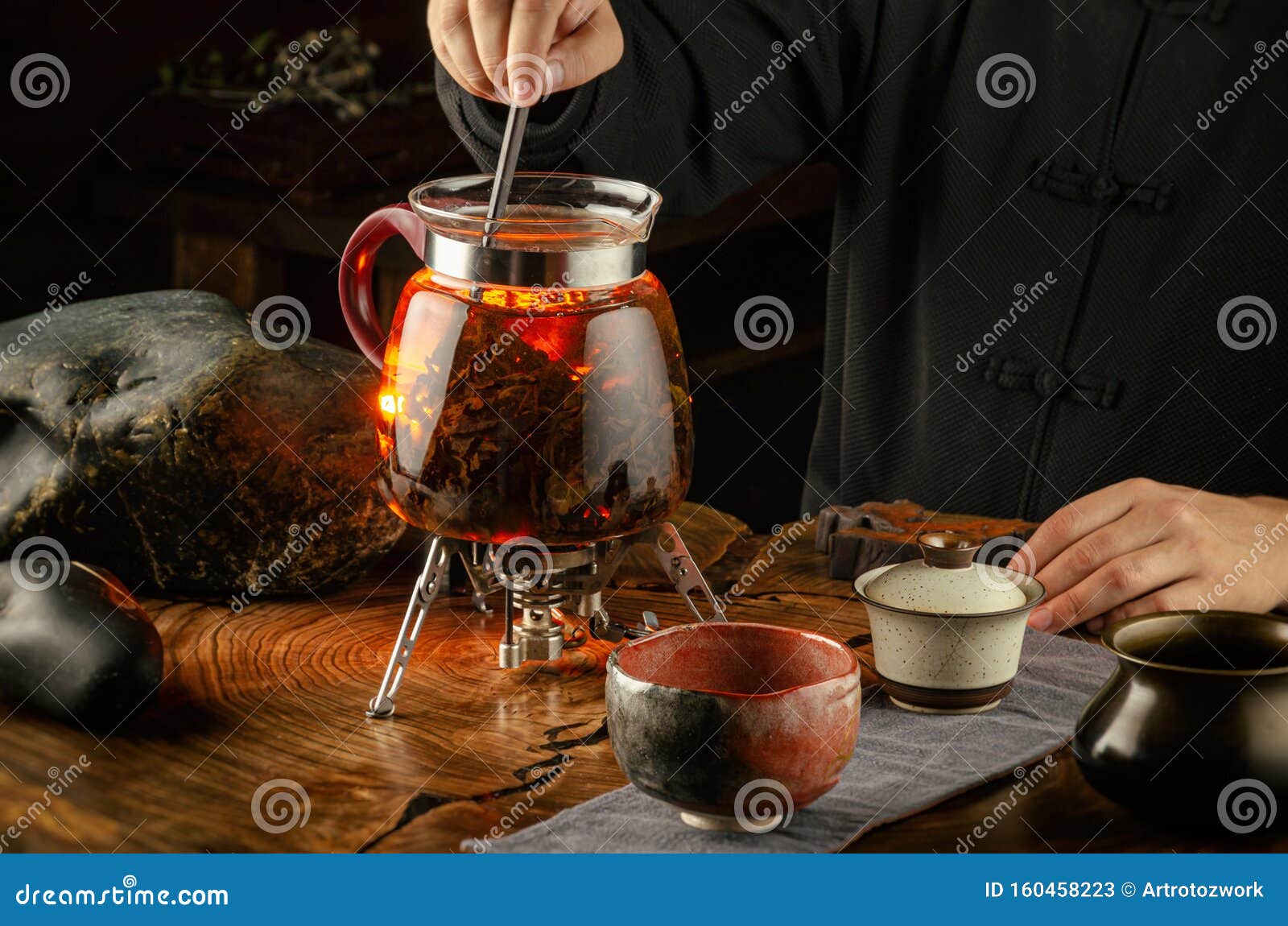 Tea Ceremony Brewing Tea on Fire in a Glass Teapot Stock Image - Image ...