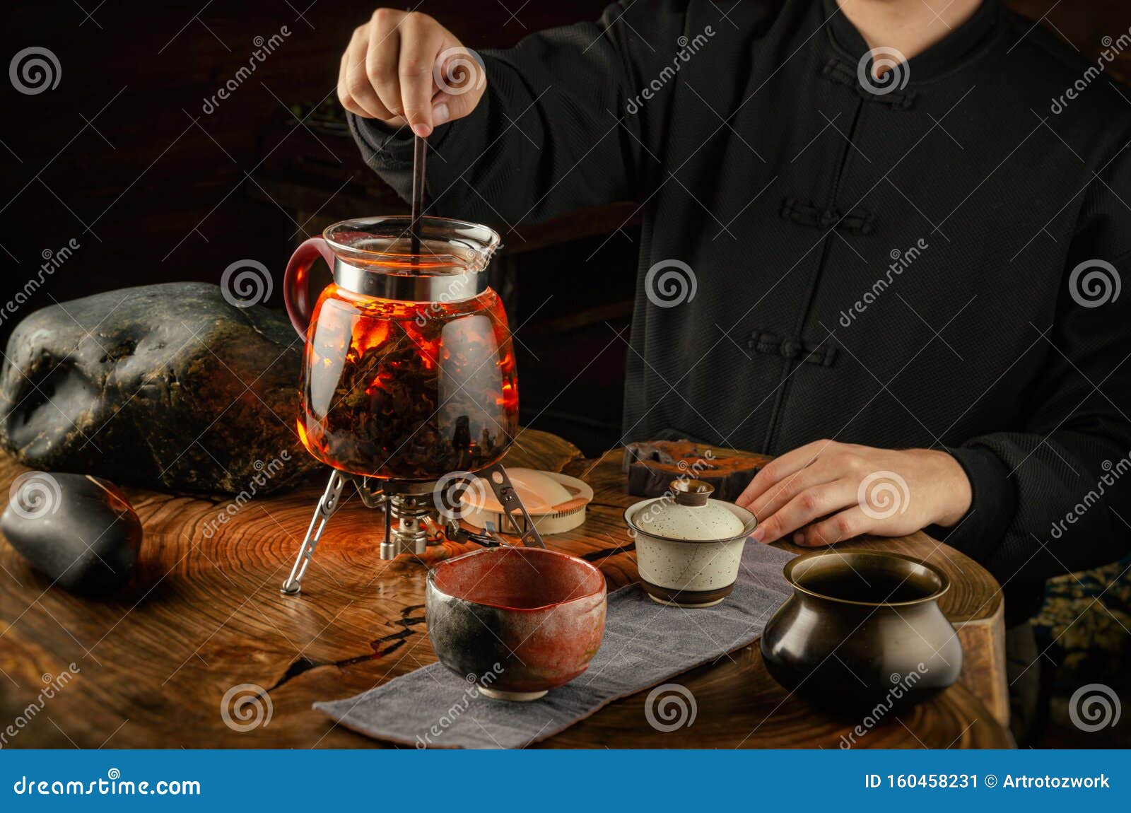 Tea Ceremony Brewing Tea on Fire in a Glass Teapot Stock Image - Image ...