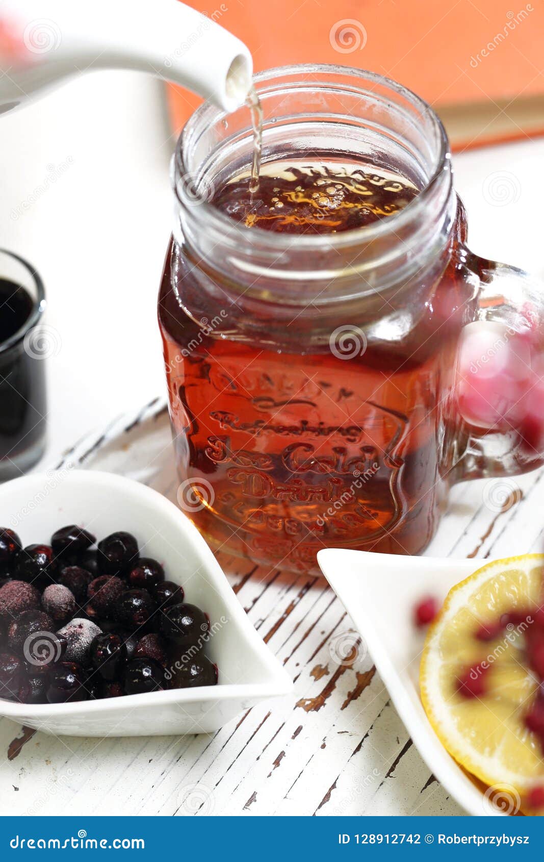 Tea with cherry fruit. stock photo. Image of colorful - 128912742