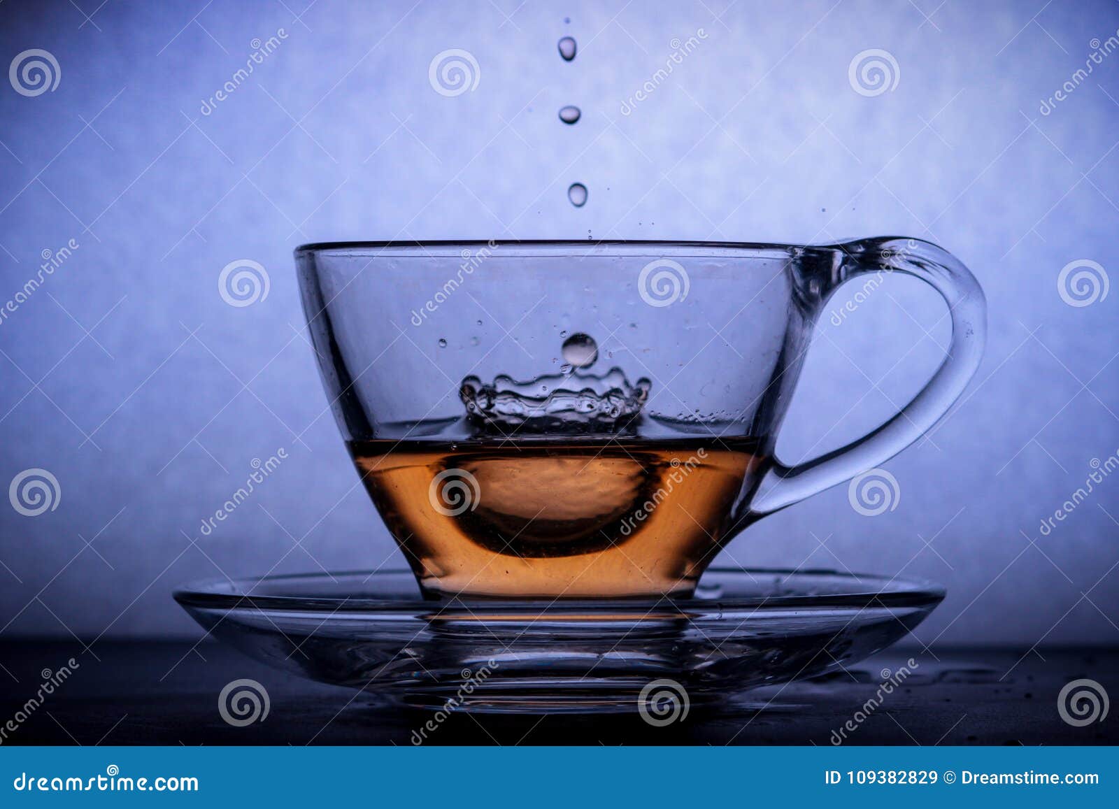 Tea Creating Splash in a Cup Stock Image - Image of greentea, color ...
