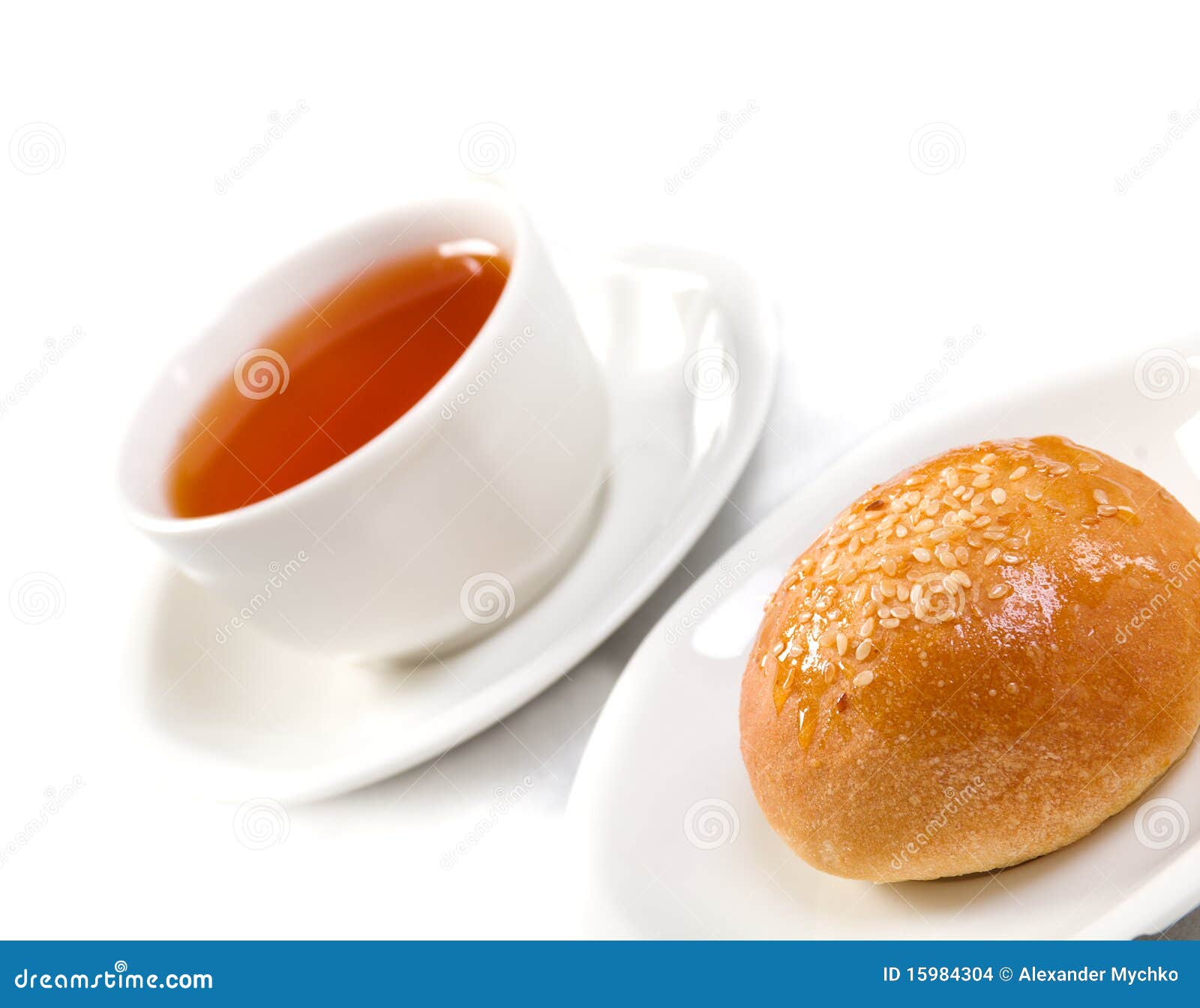 Tea cup and bun against stock photo. Image of white, horizontal - 15984304
