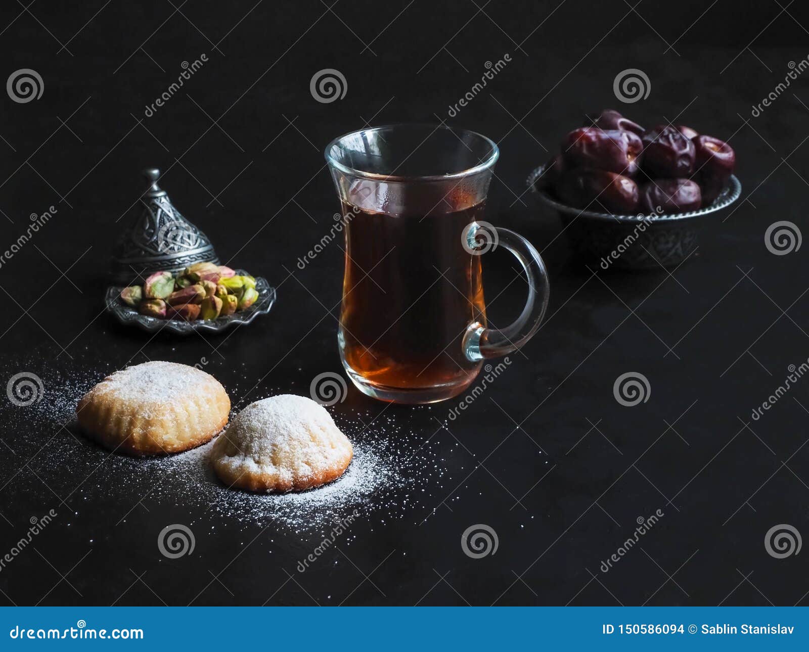Tea Cup with Egyptian Cookies `Kahk El Eid` and Dates on the Black ...