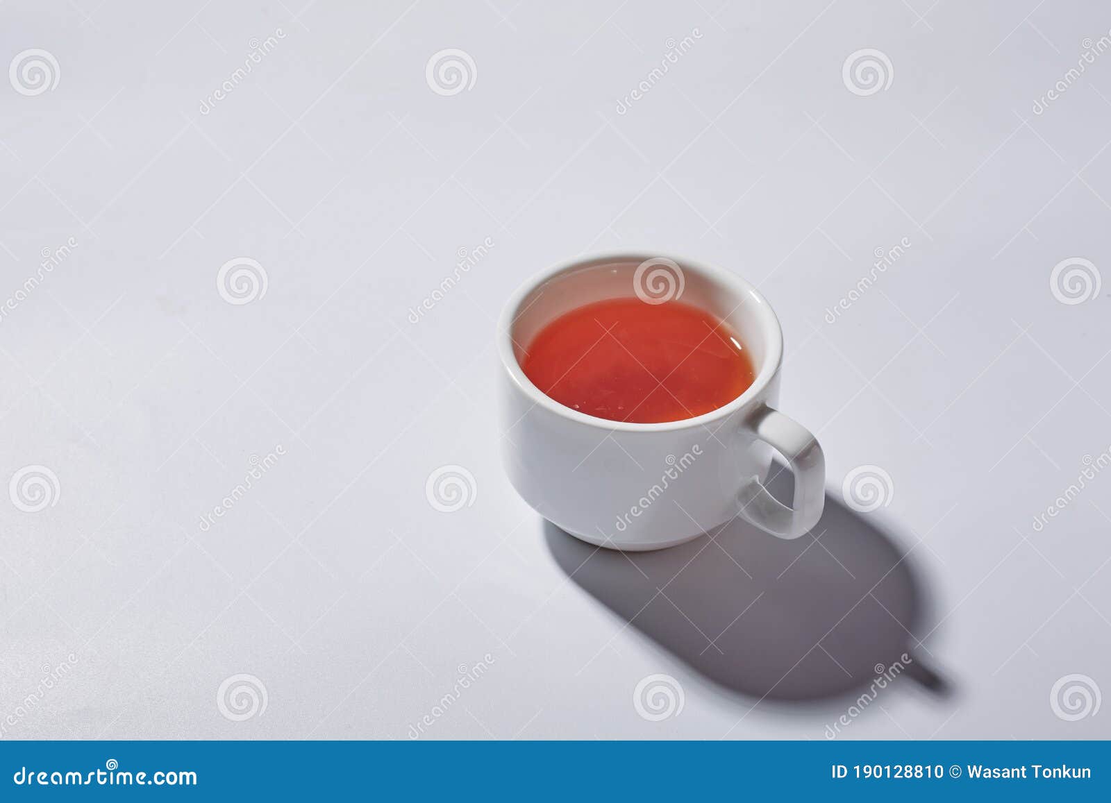 Tea cup with hard light stock photo. Image of liquid - 190128810