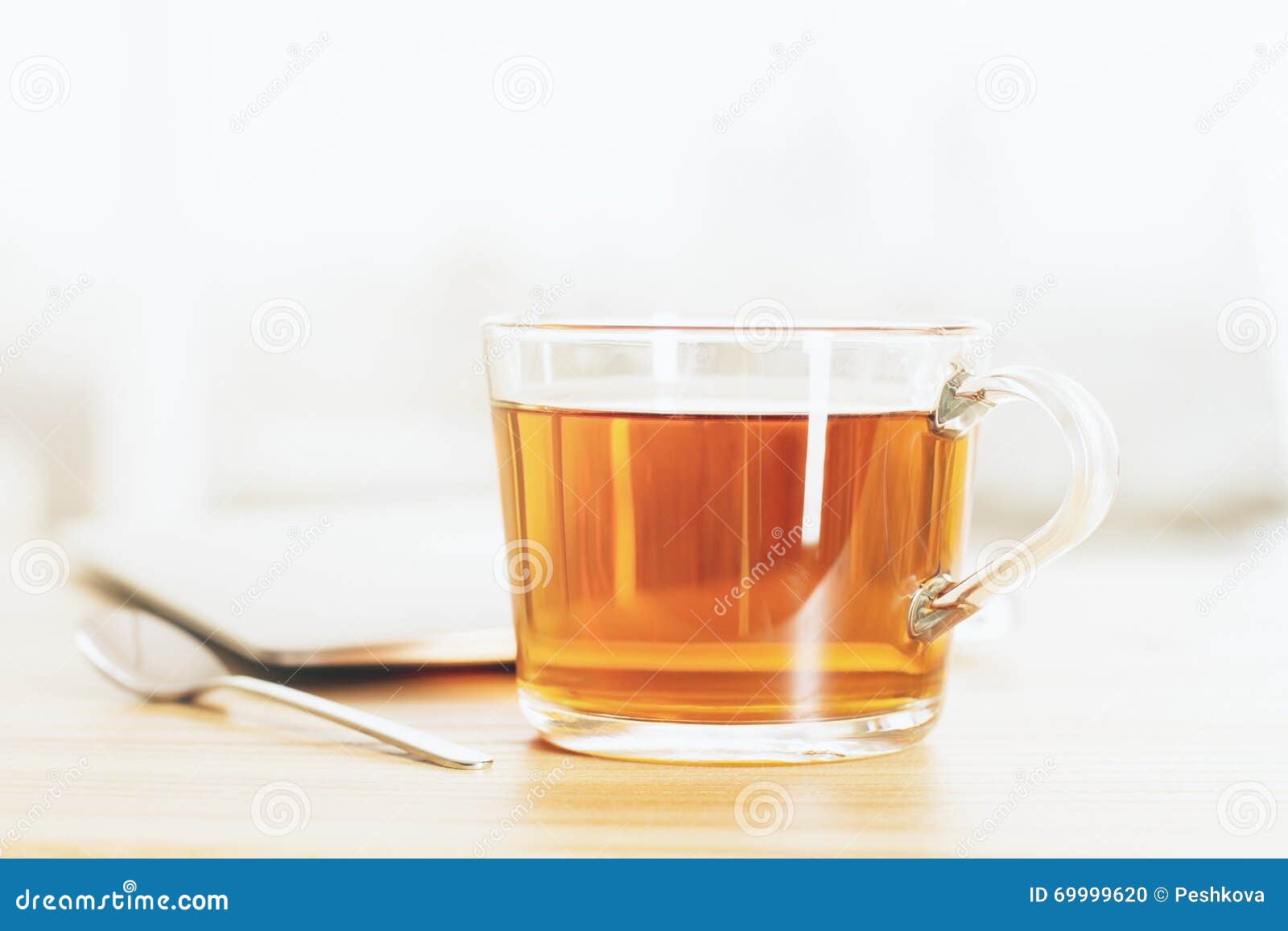 Tea cup and spoon stock photo. Image of morning, food - 69999620