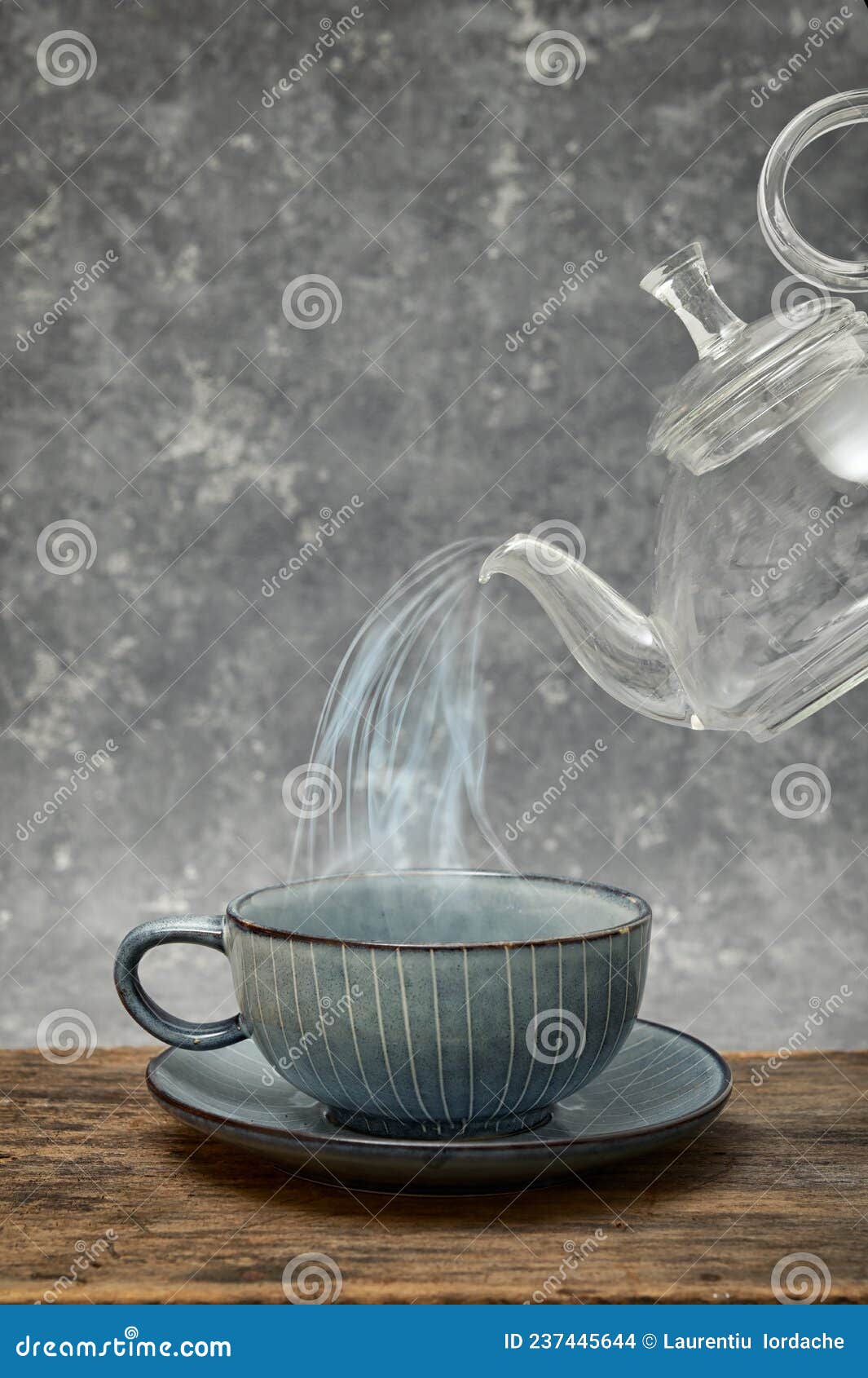 Teapot Pouring Tea Into Antique Flowered Cup Stock Photo ...