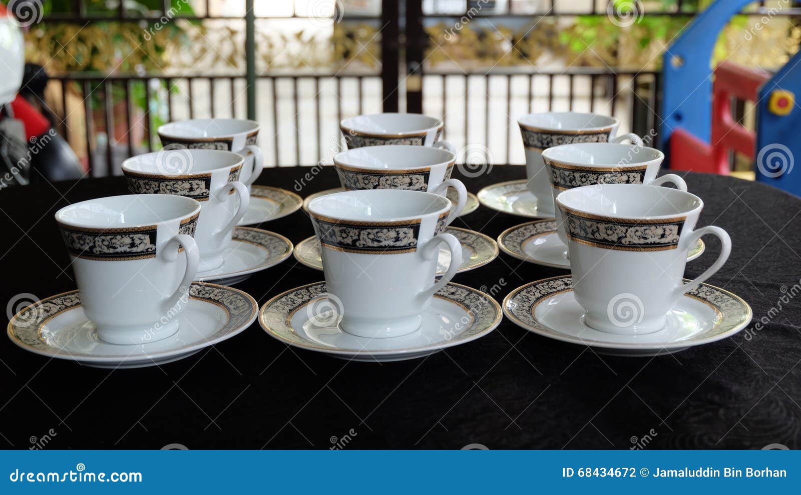 Tea cups on the plate stock photo. Image of table, arranged - 68434672