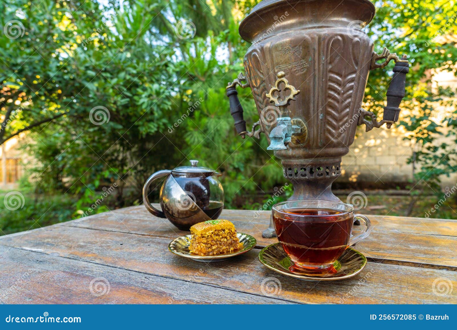 Tea Drinking from a Vintage Samovar with Oriental Sweets Stock Image ...