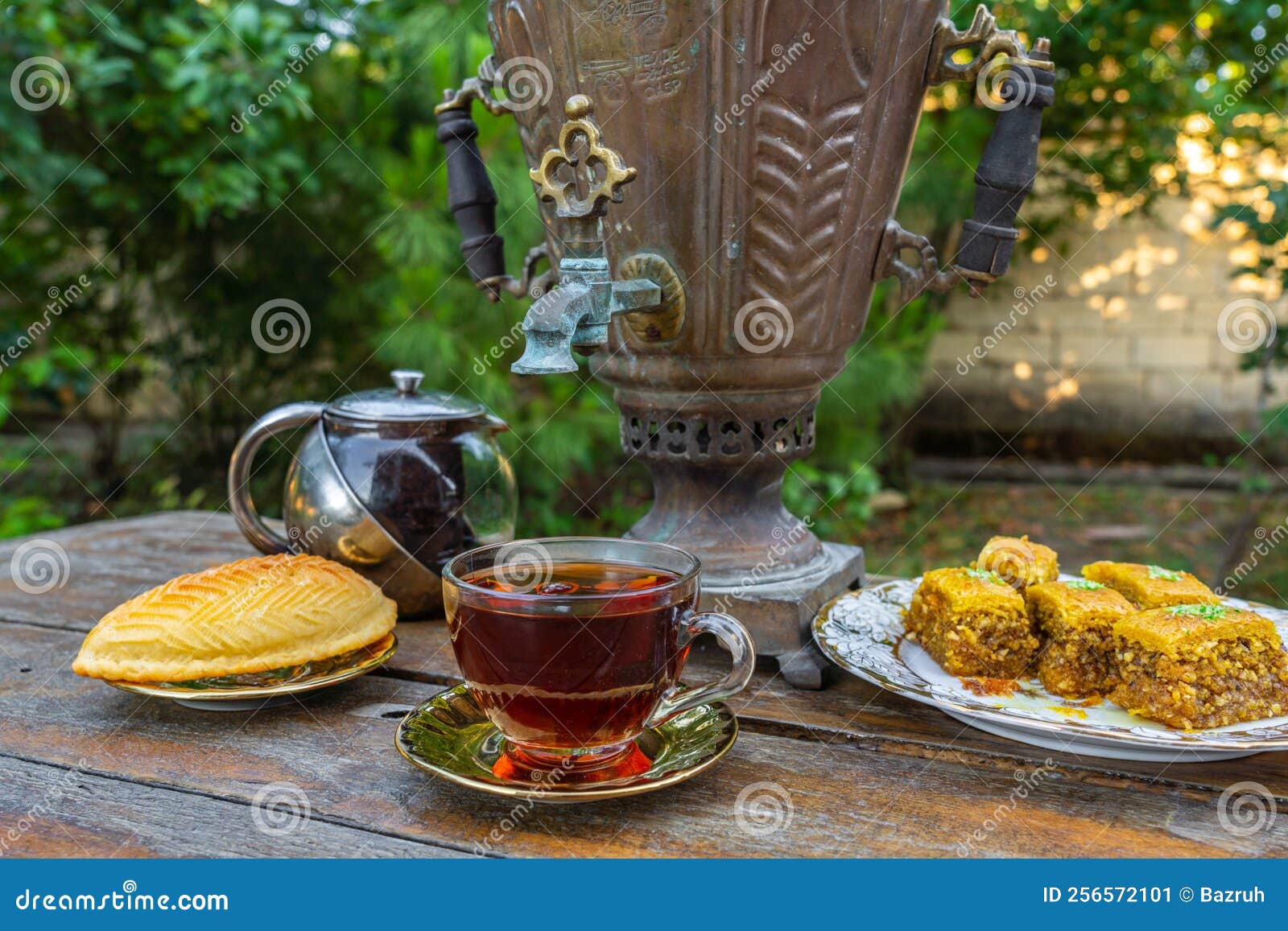Tea Drinking from a Vintage Samovar with Oriental Sweets Stock Image ...