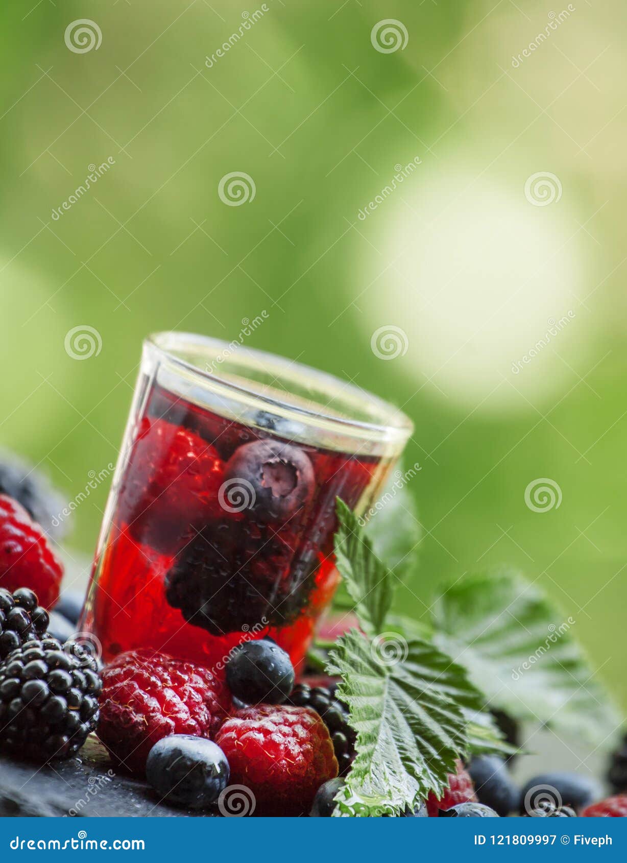 Tea with Forest Berries on a Green Natural Background, Selective Stock ...