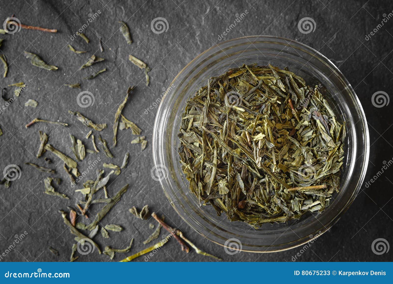 Tea Leaves on the Glass Jar on the Dark Stone Background Top View Stock ...