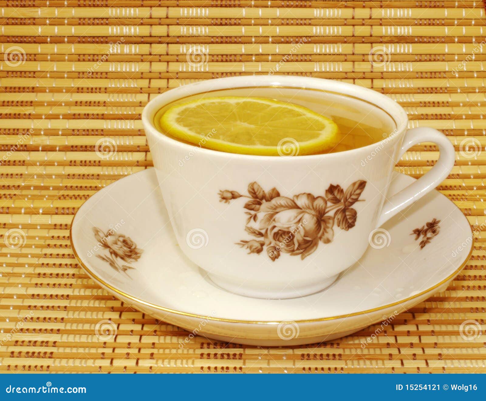 Tea with Lemon in a Cup with a Brown Pattern Stock Image - Image of ...