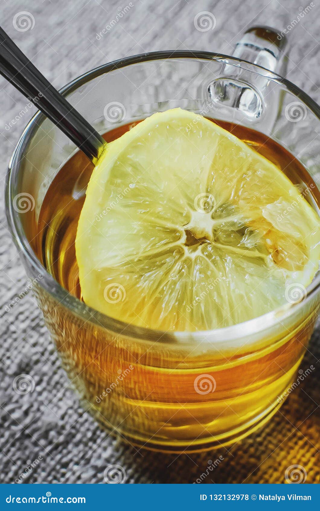 Tea with lemon in a glass stock photo. Image of kitchen - 132132978