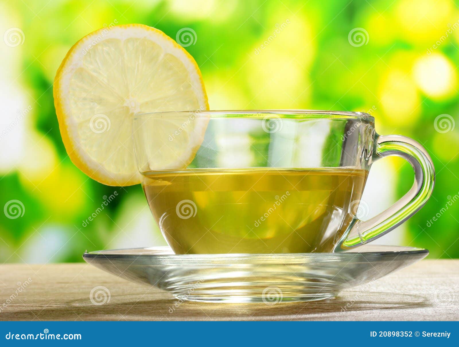 Tea with Lemon on Green Leaves Stock Photo - Image of plate, glass ...