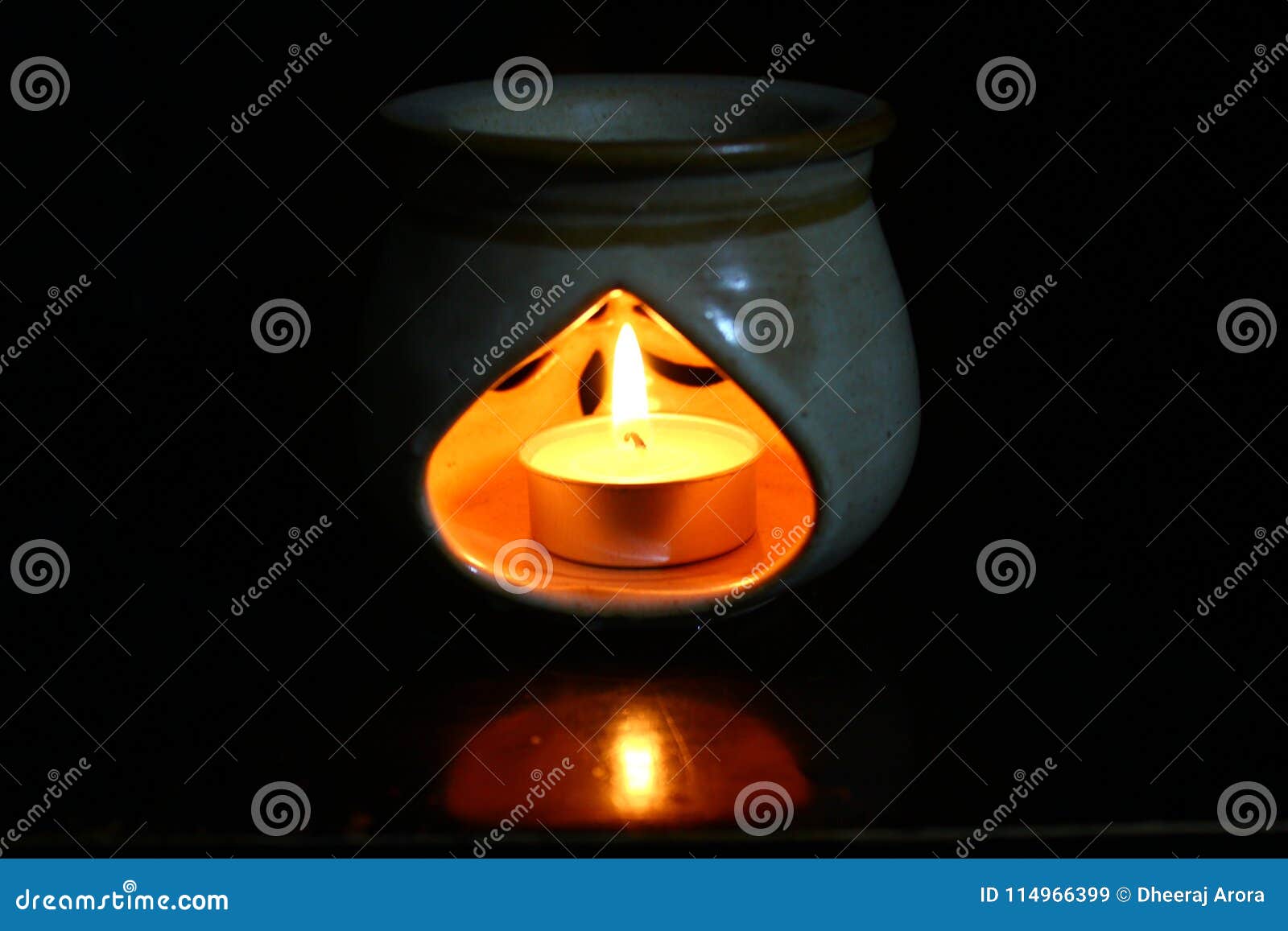 Tea Light Candle Burning Inside Ceramic Diffuser Stock Image - Image of ...