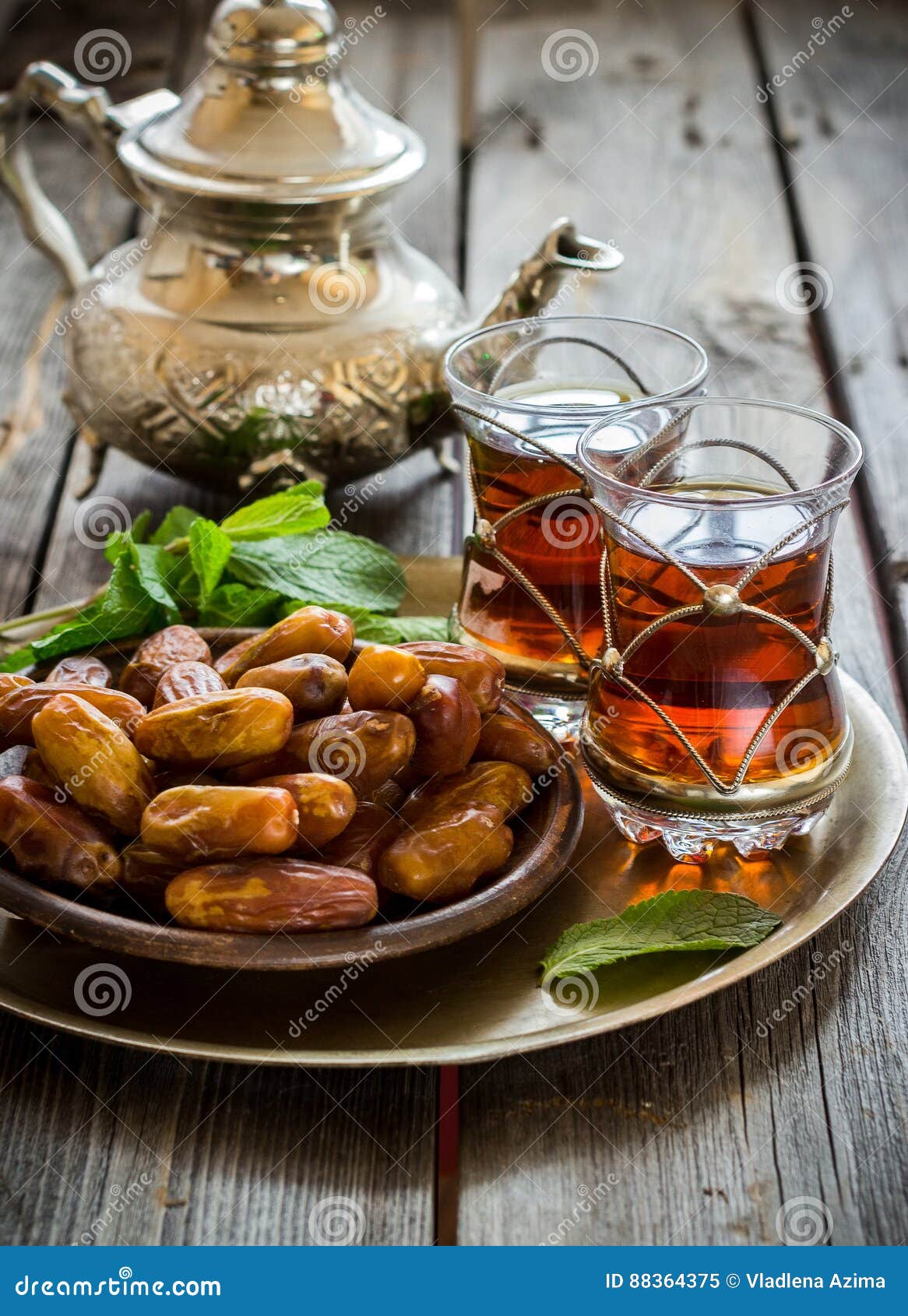 Tea with Mint in Arab Style and Dates on Wooden Table. Stock Image ...