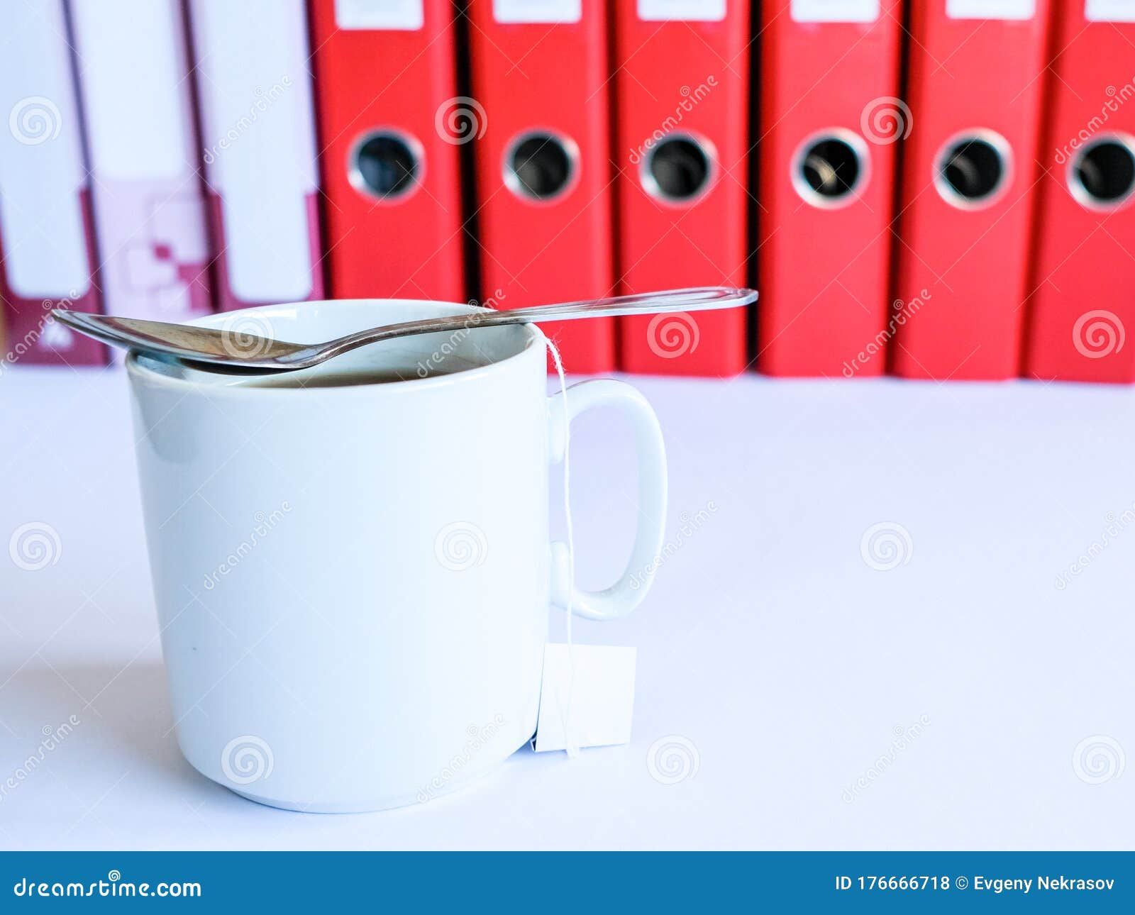 Tea at the Office. White Ceramic Mug with Tea on the Background of Red ...