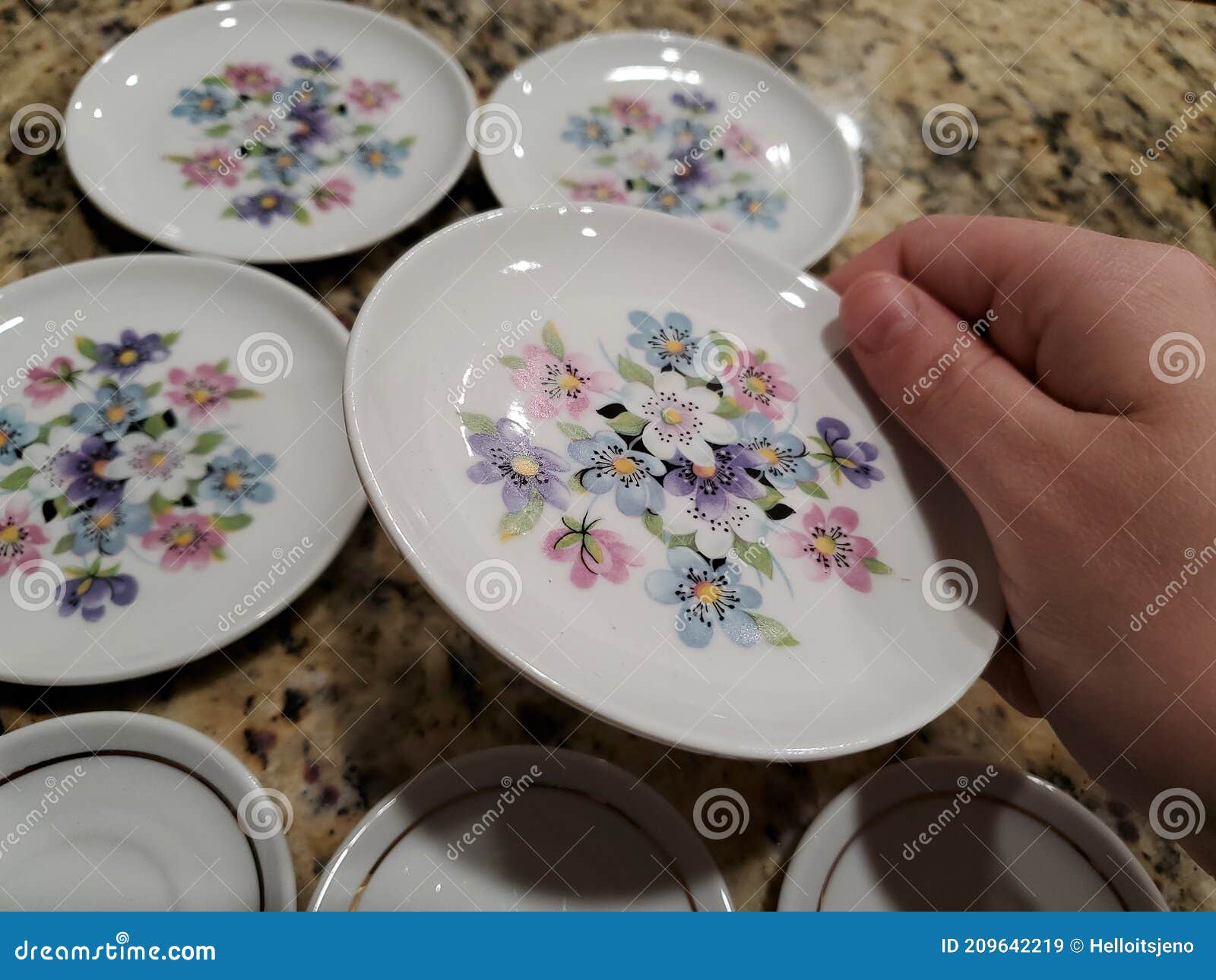 Tea plates with flowers stock image. Image of petal - 209642219