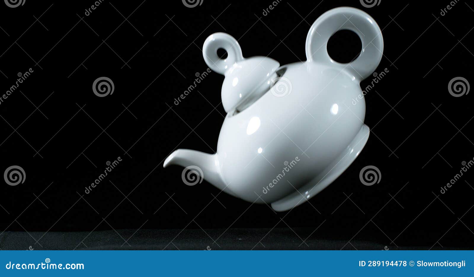 Tea-Pot Falling on Black Background Stock Photo - Image of impact ...
