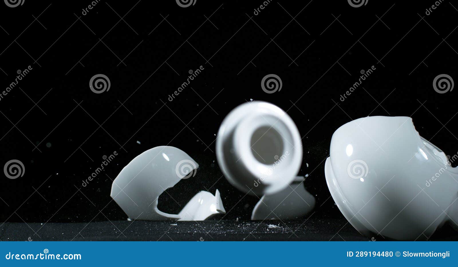Tea-Pot Falling and Exploding on Black Background Stock Photo - Image ...