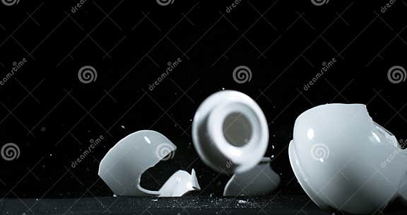 Tea-Pot Falling and Exploding on Black Background Stock Photo - Image ...