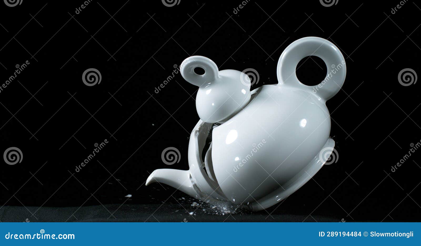 Tea-Pot Falling and Exploding on Black Background Stock Photo - Image ...