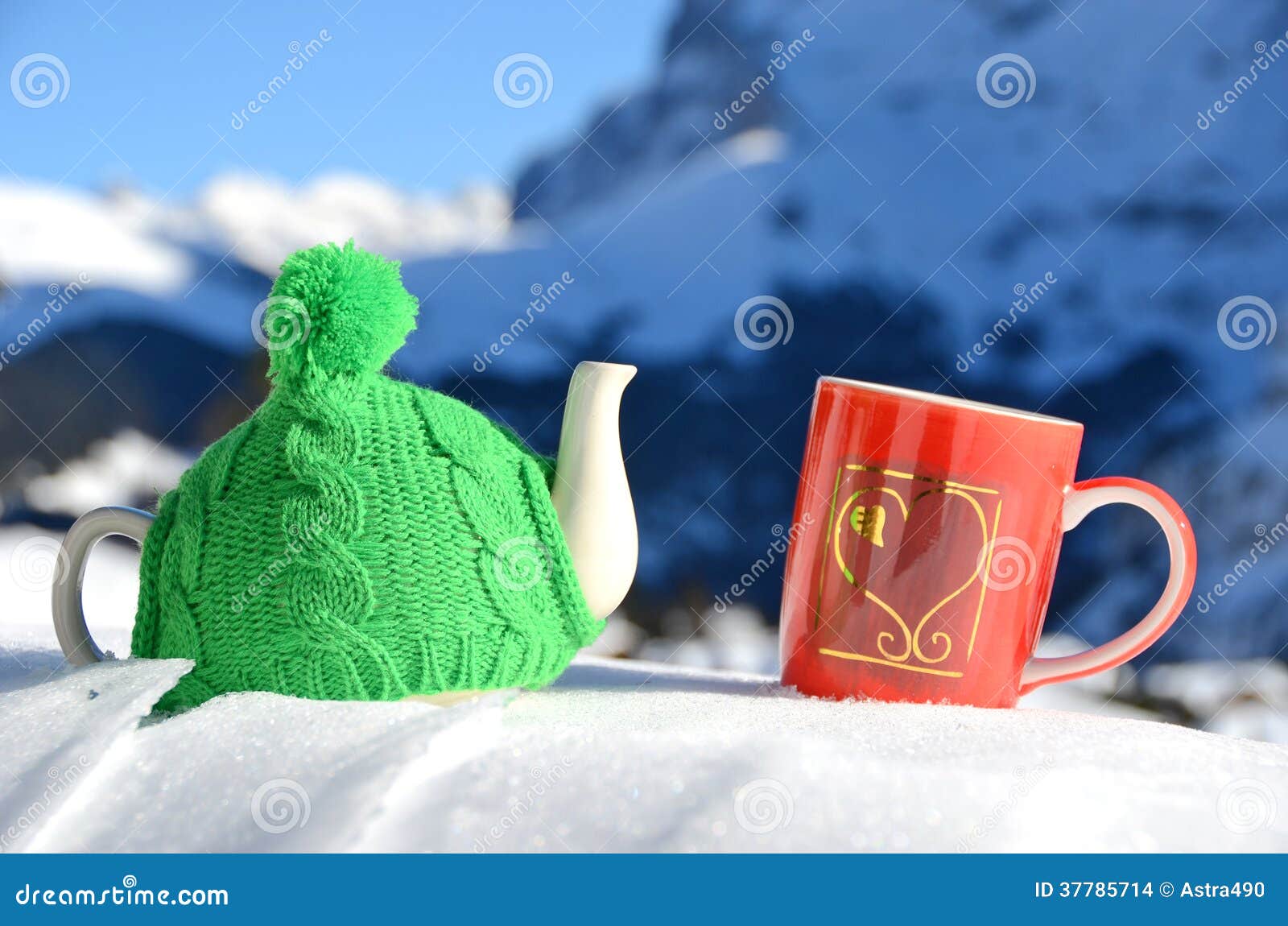 Tea Pot in the Knitted Cap and Red Cup Stock Photo - Image of freeze ...