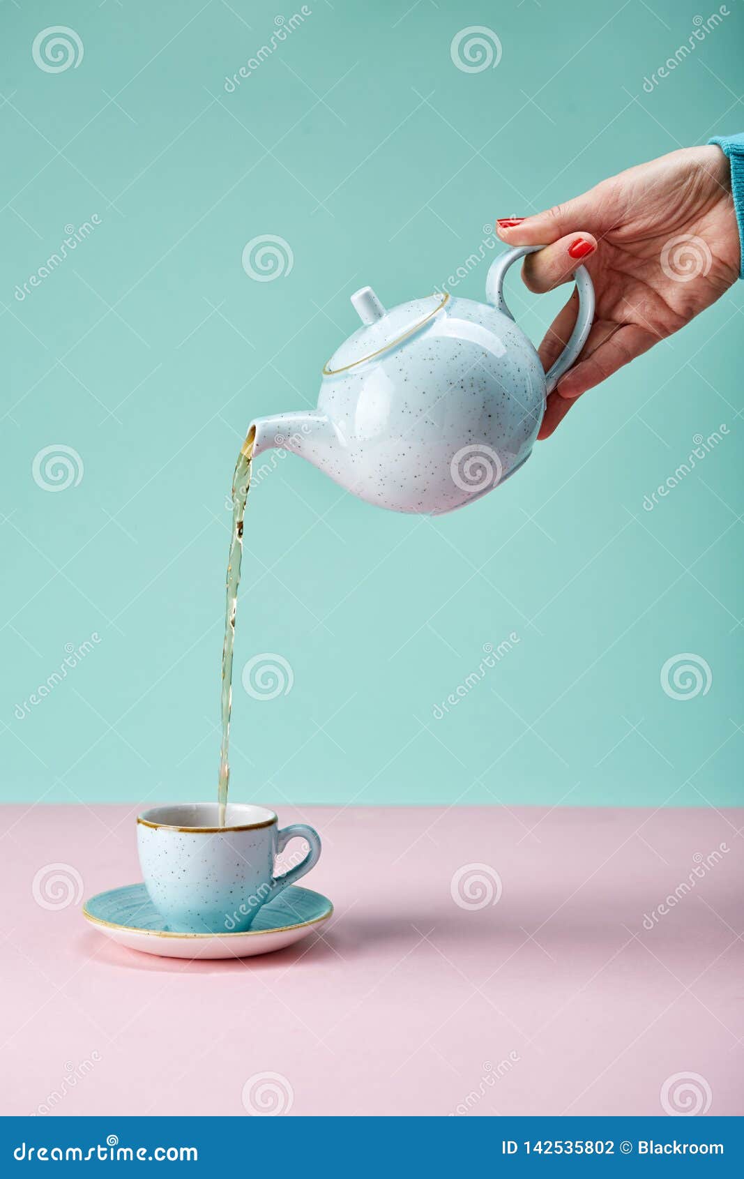 Tea pot pouring tea stock photo. Image of copy, pottery - 142535802