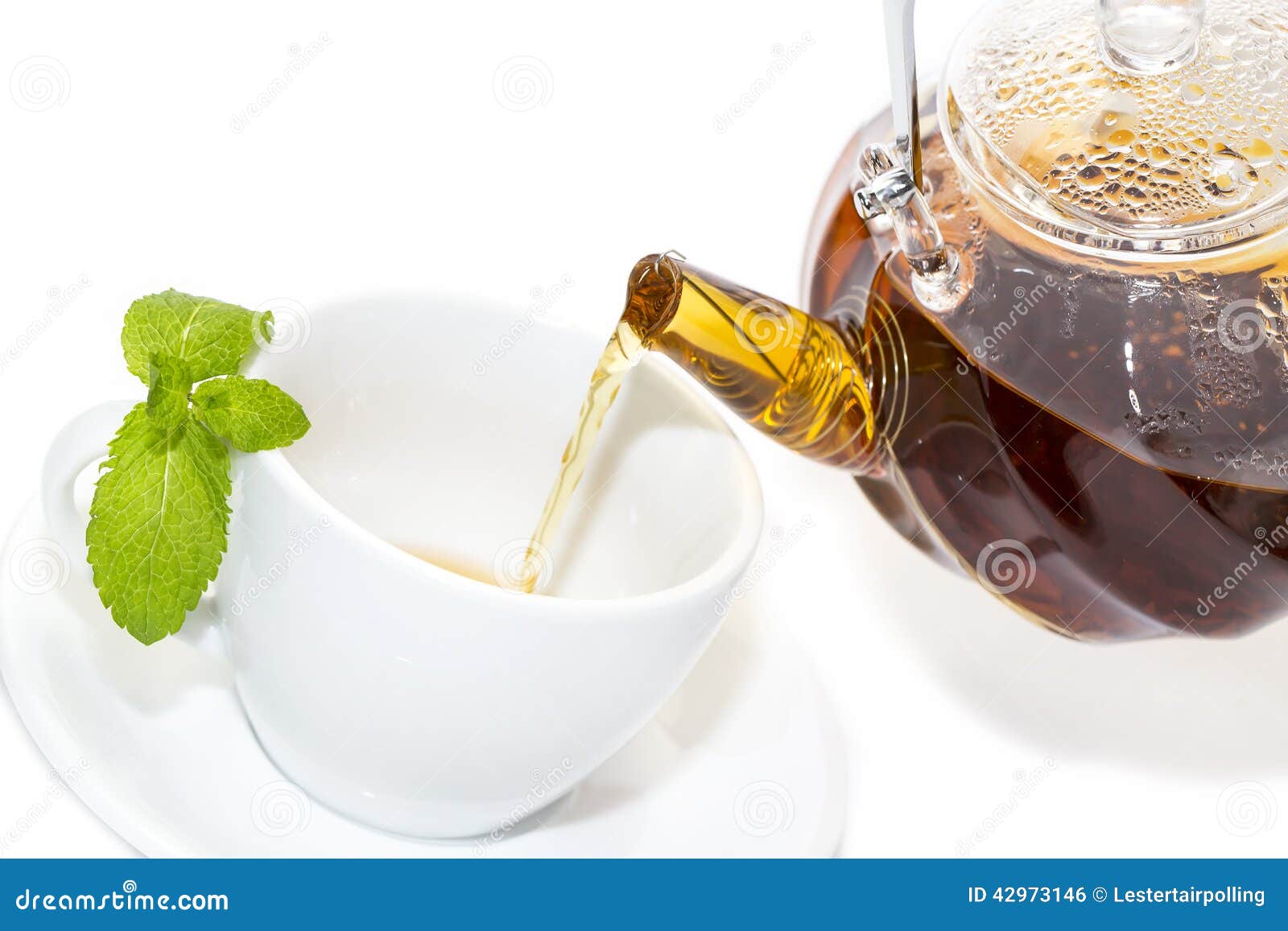 Tea poured from a teapot stock photo. Image of herbal - 42973146