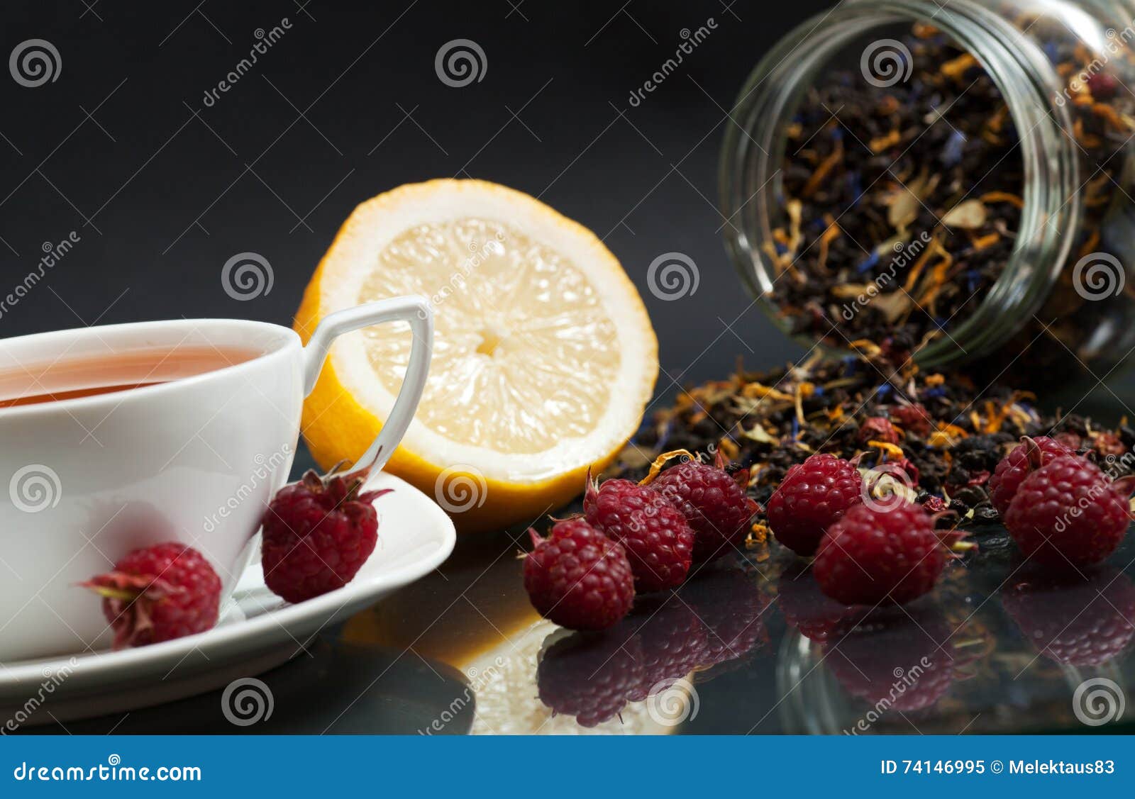Tea and raspberries stock image. Image of lemon, alternative - 74146995