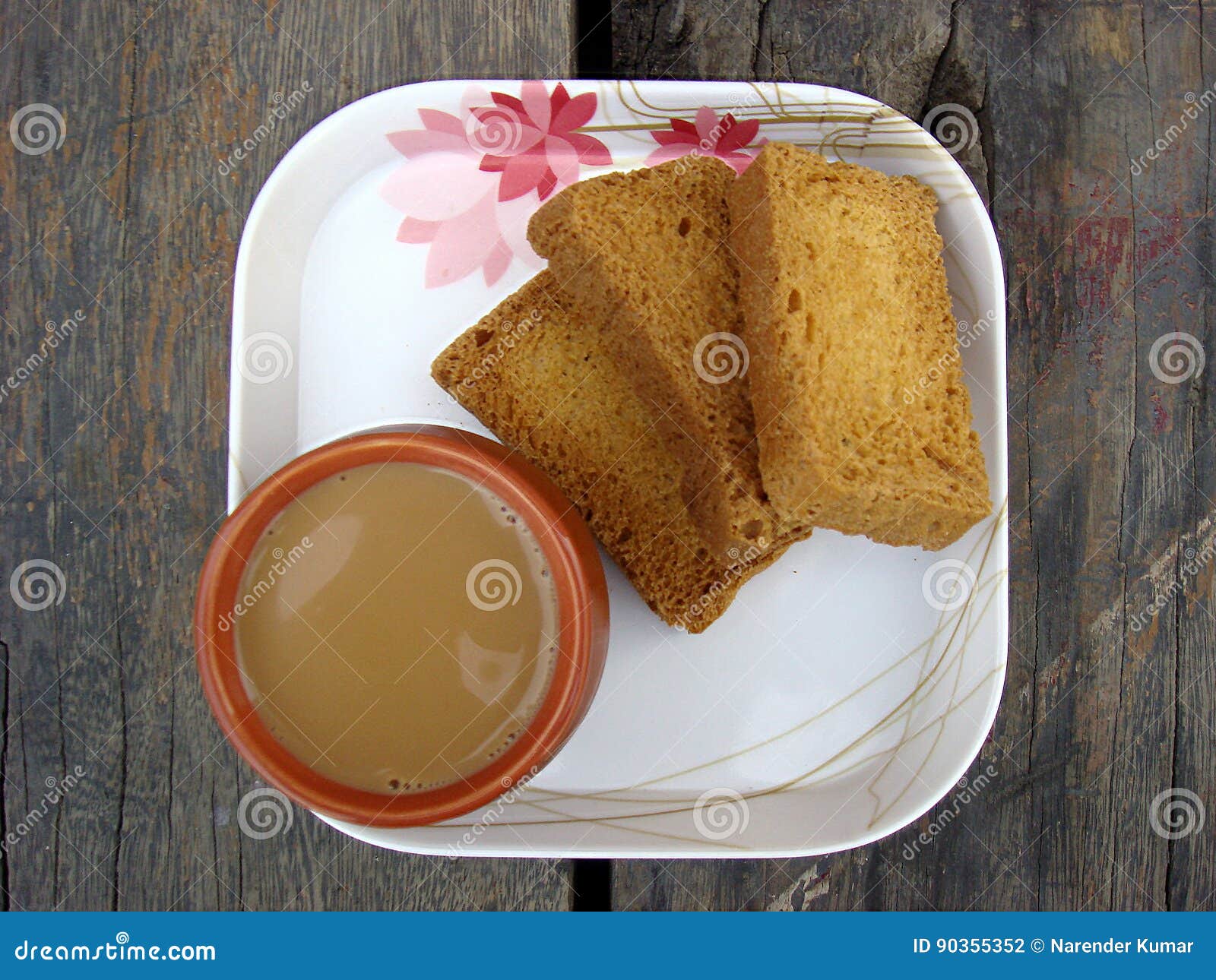 Tea and rusk in plate stock photo. Image of refreshment - 90355352