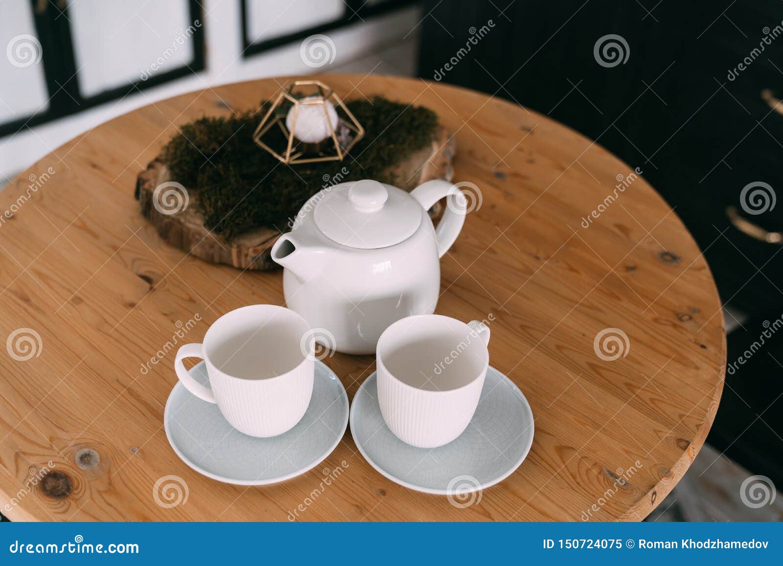 Tea Set, White Teapot and Two Cups on Saucers on Wooden Table Stock ...