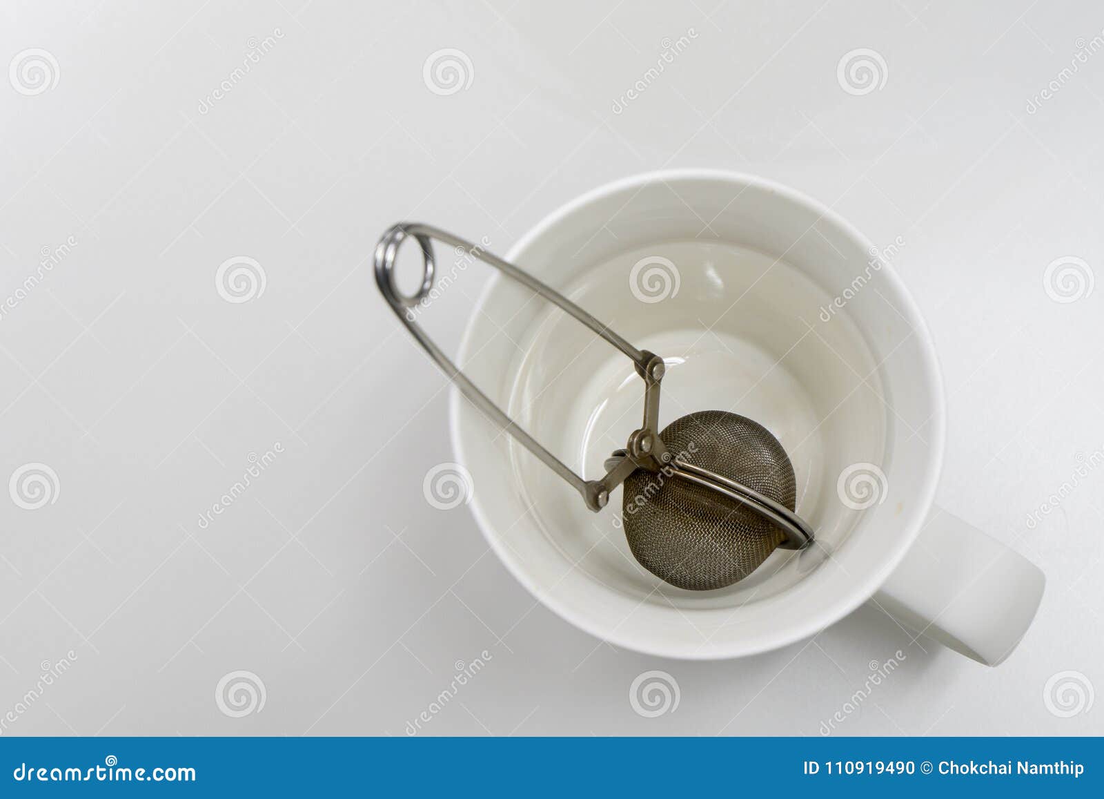 Tea Strainer Spring Mesh Ball Enclosure of Old in the White Cup Stock ...