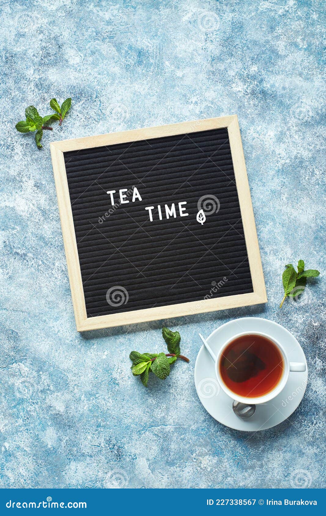 Tea Time. Black Letter Board with Text on Blue Table with Glass Cup of ...