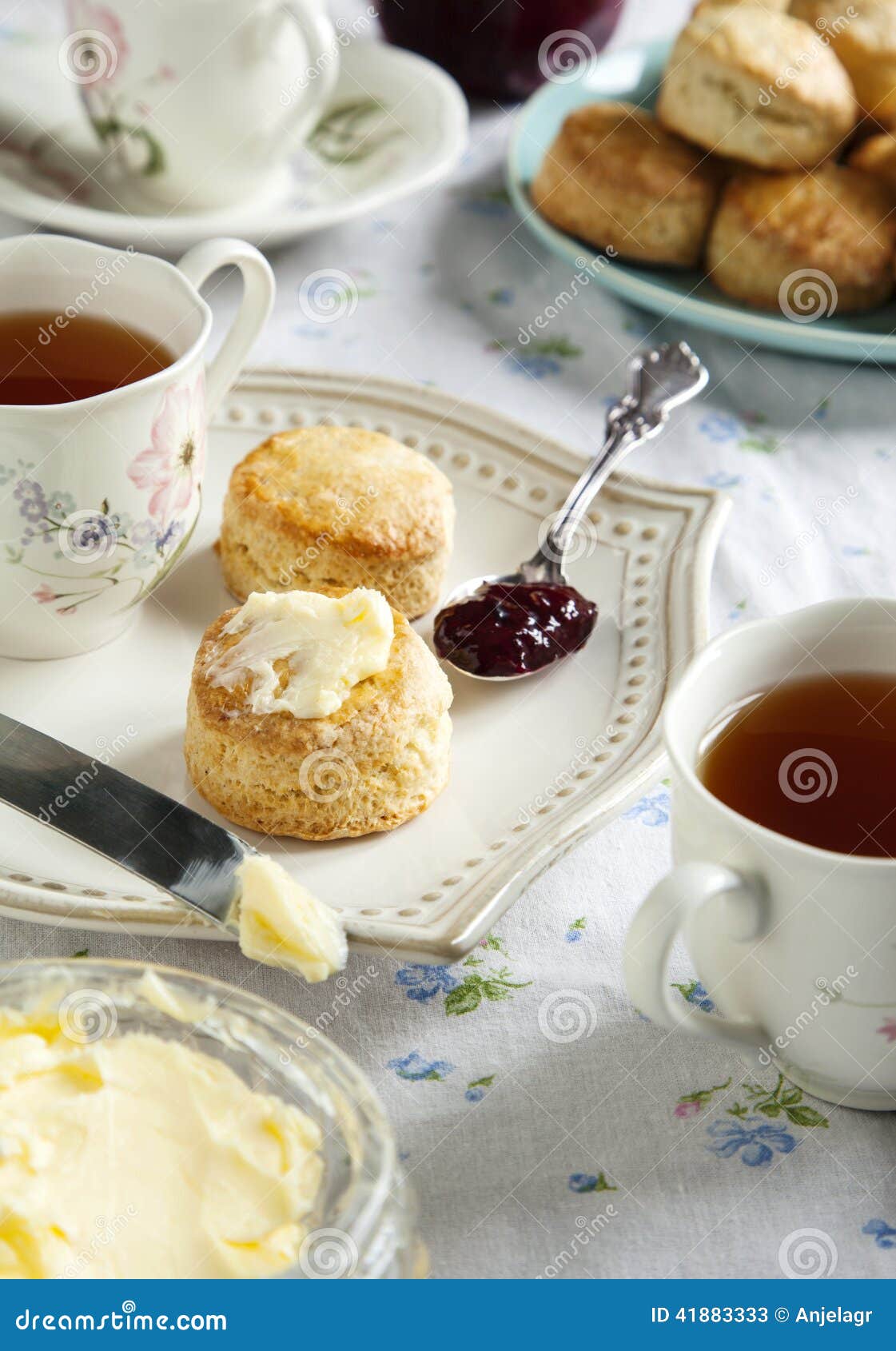 Tea time with scones stock image. Image of butter, knife - 41883333