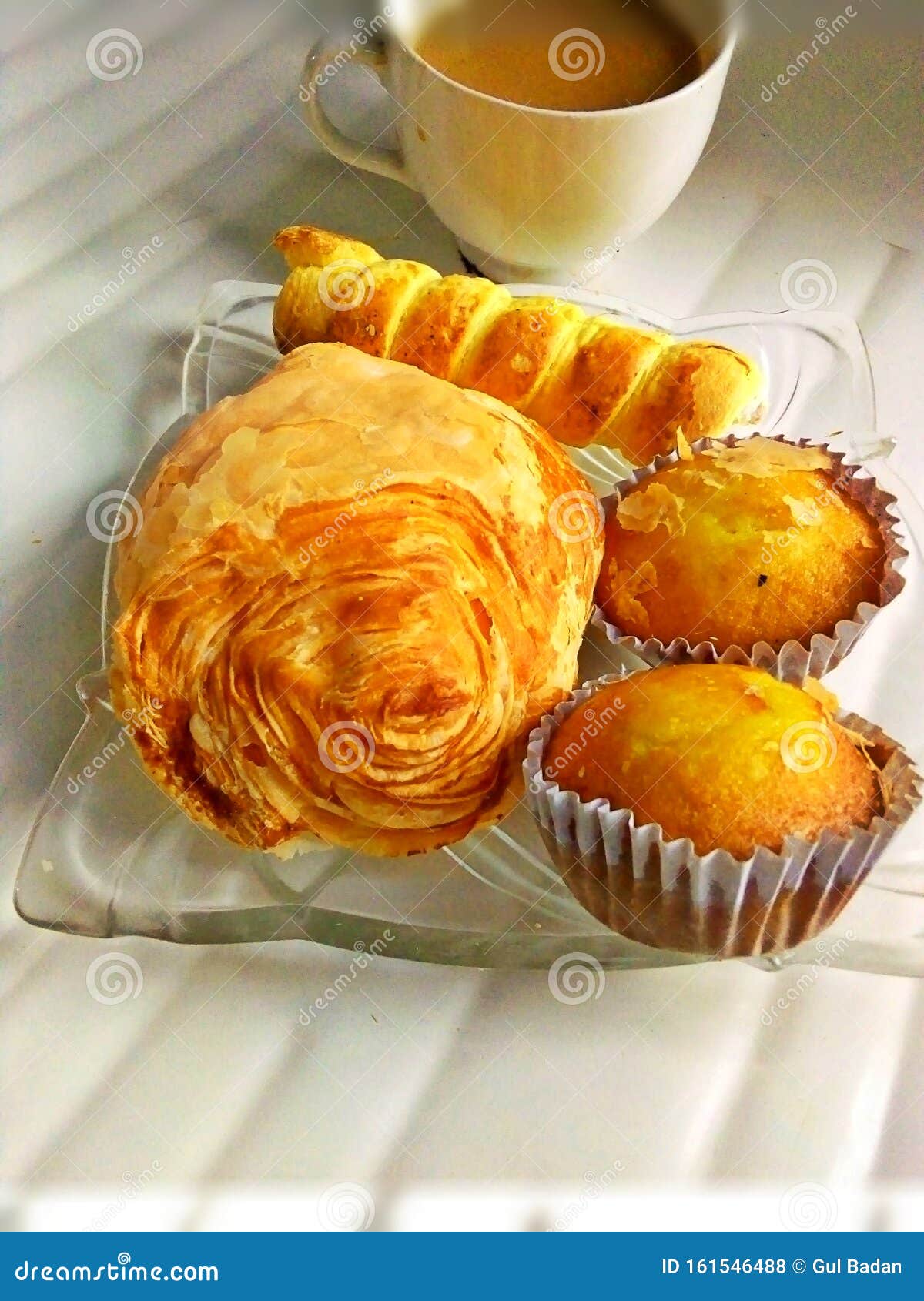 Tea Time Snaks Cream Roll Cup Cakes with Cup of Tea Stock Photo - Image ...